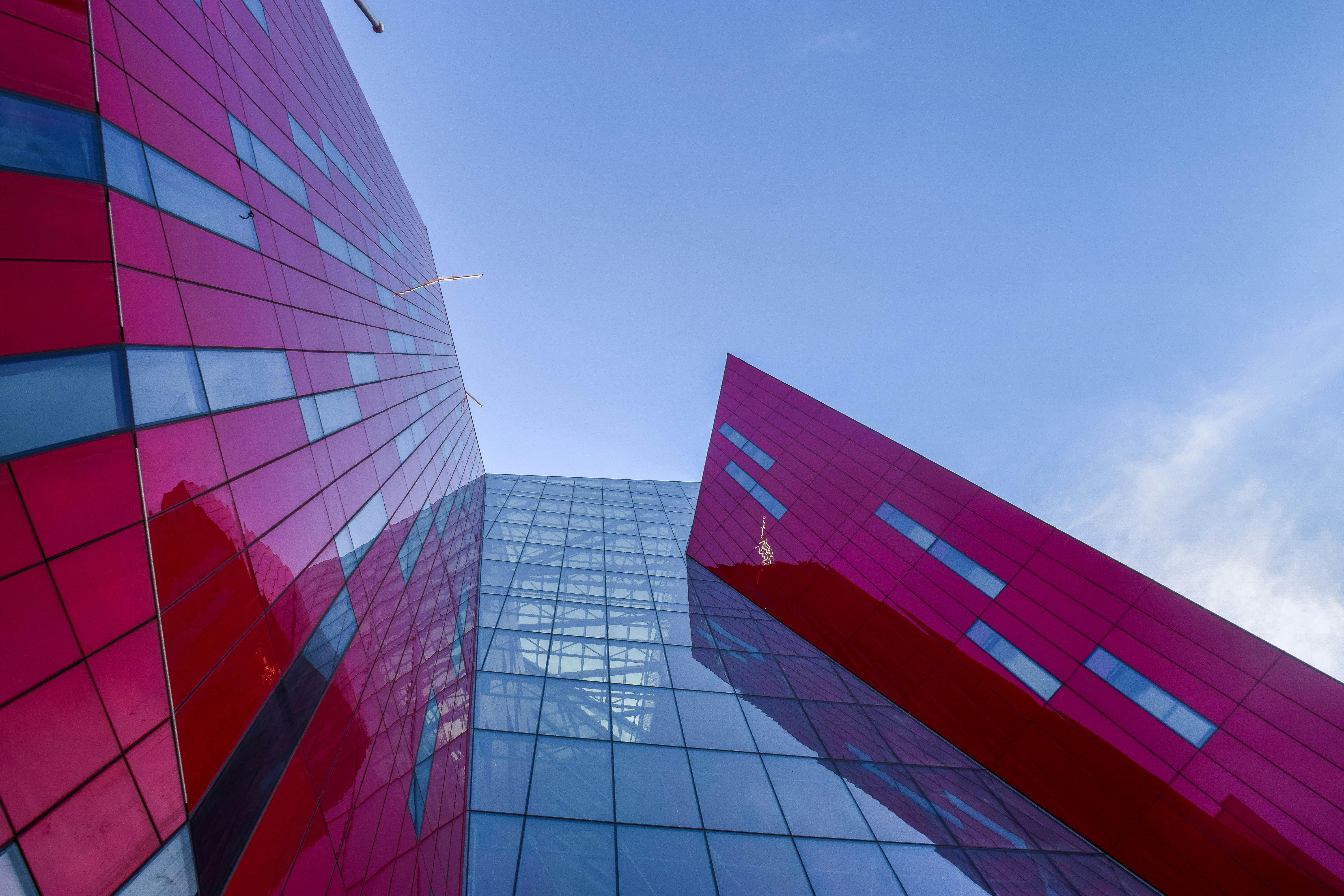 Red Glass Panel Building Under the Sky · Free Stock Photo