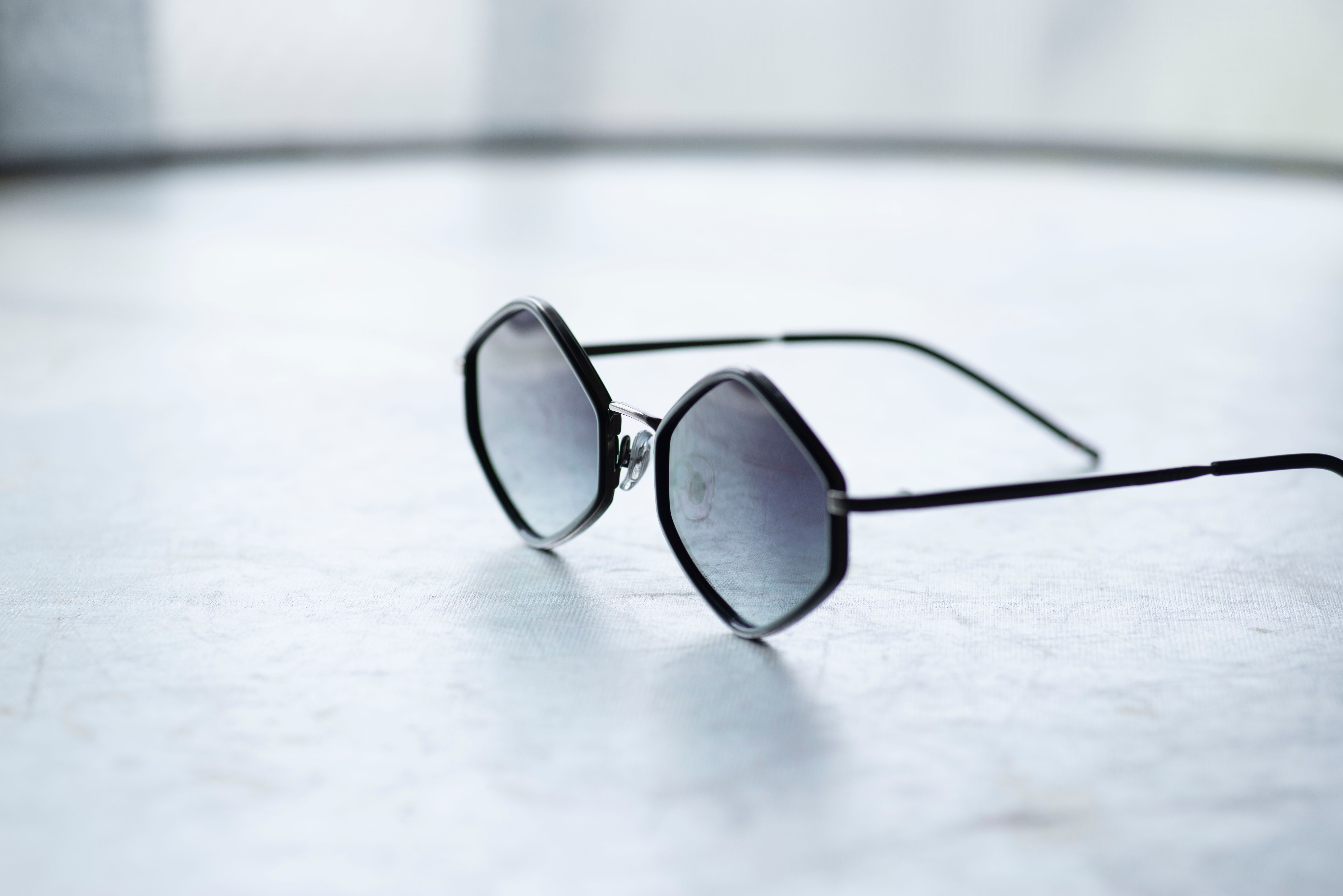 Person Holding a Sunglasses · Free Stock Photo