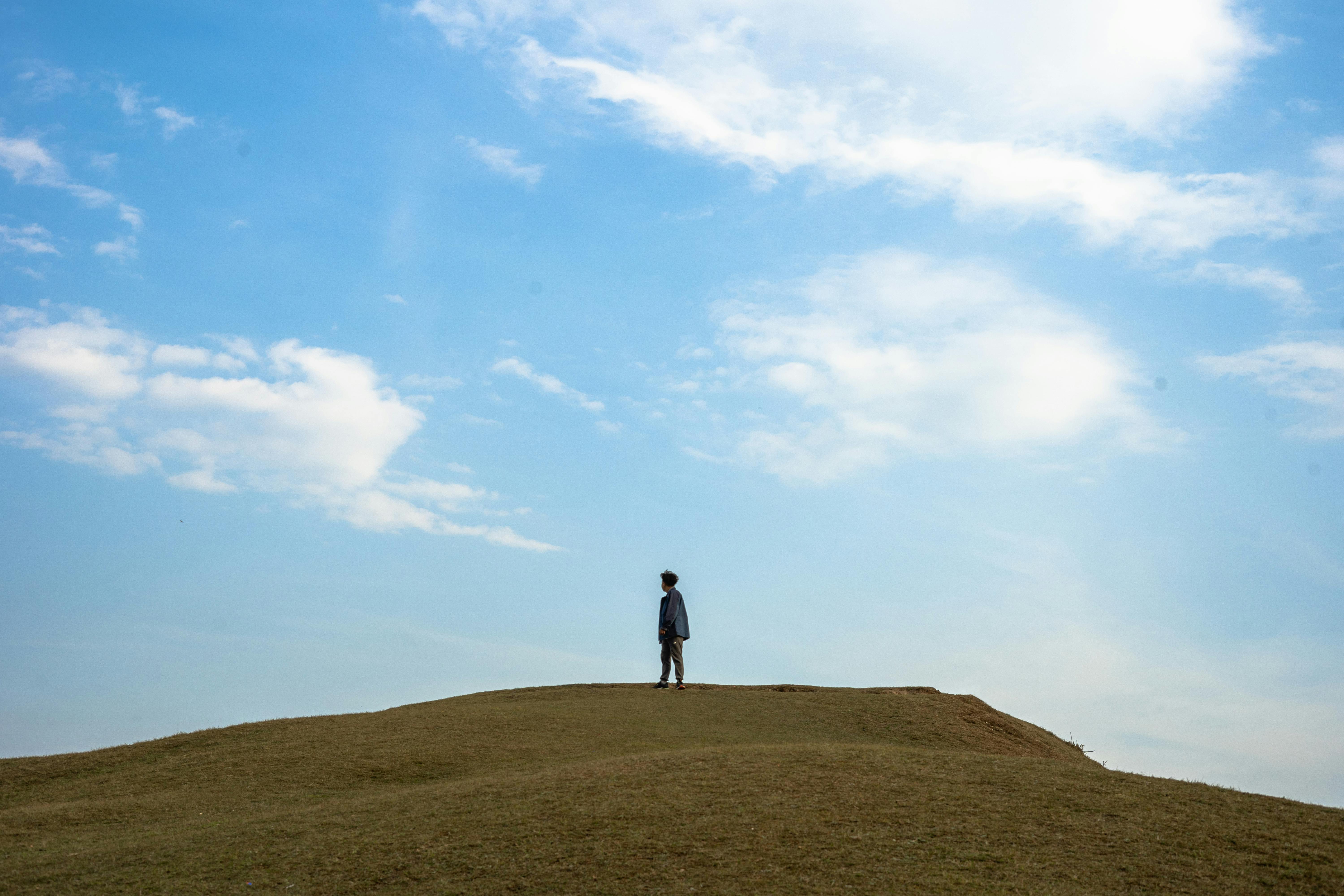 A Man Standing on the Grass · Free Stock Photo