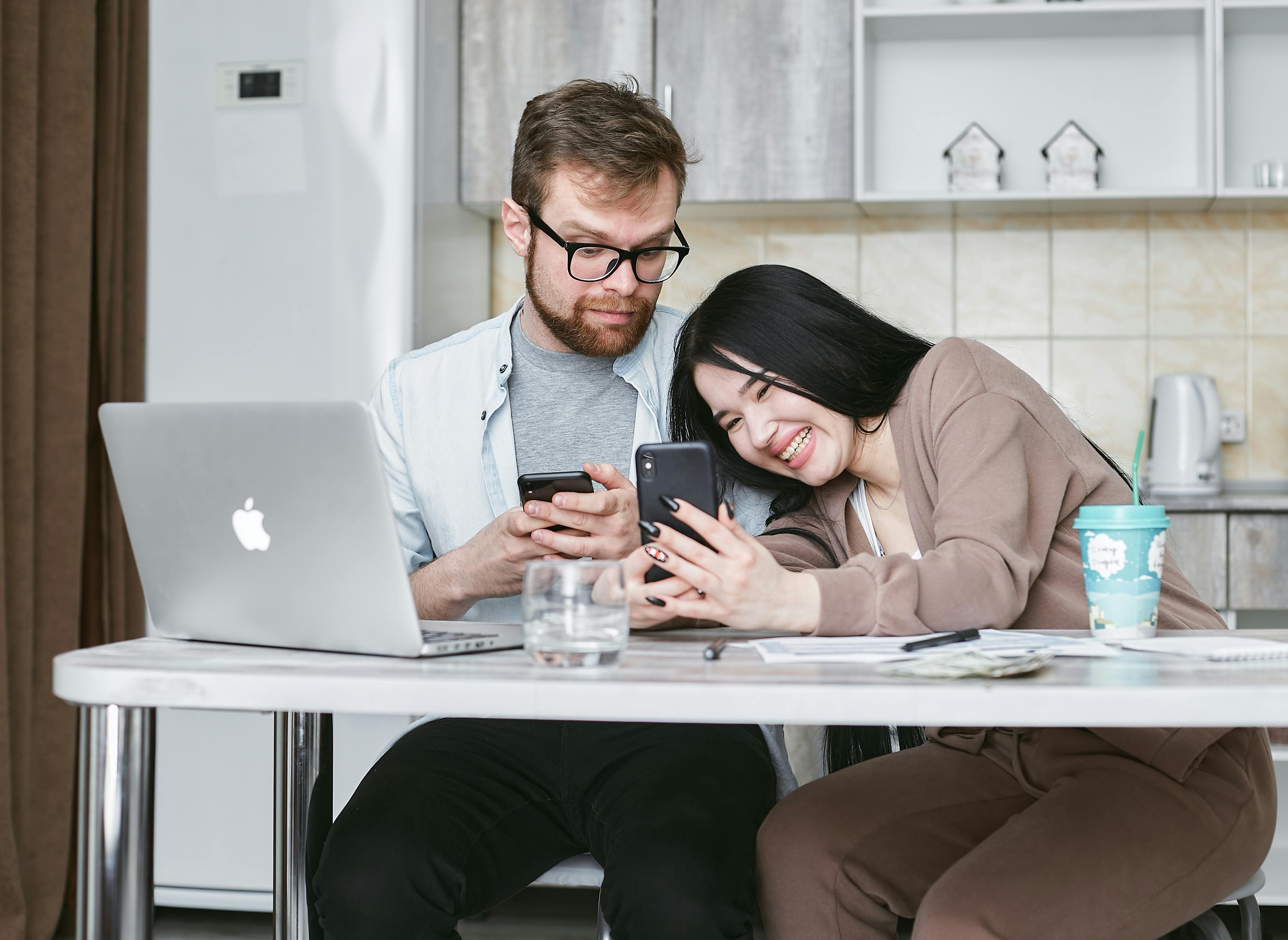 A Couple Using Modern Electronic Devices · Free Stock Photo