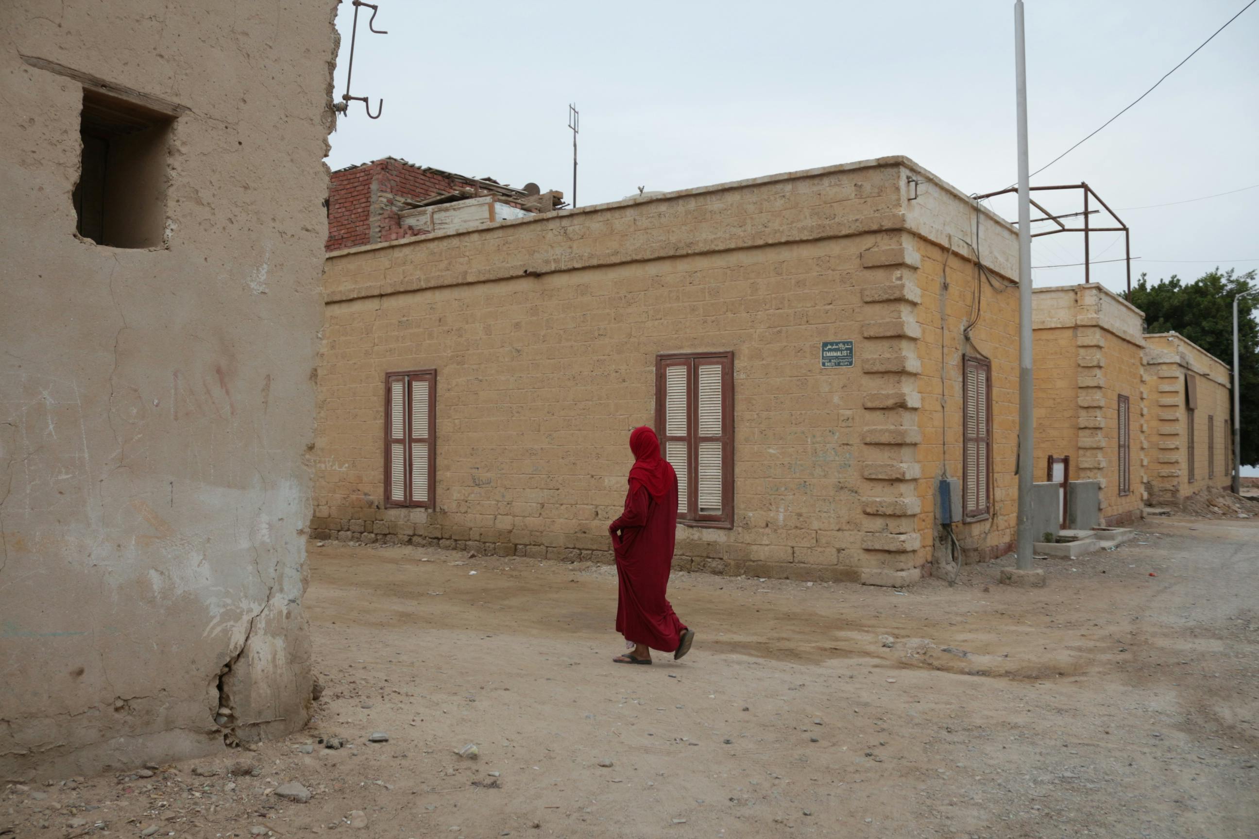 A Person Walking Outside the House · Free Stock Photo