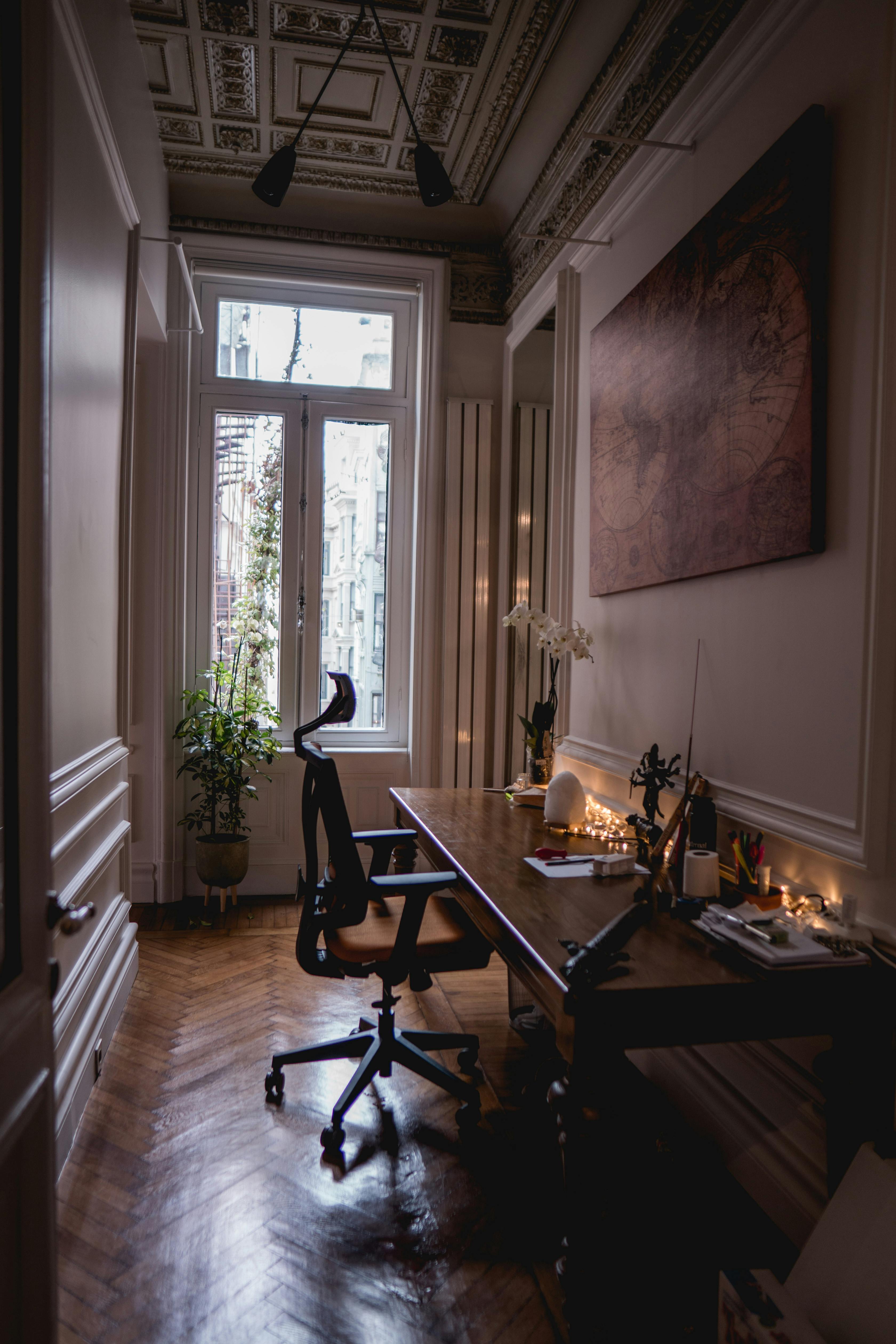 Narrow Room with Office Chair and Brown Wooden Table · Free Stock Photo