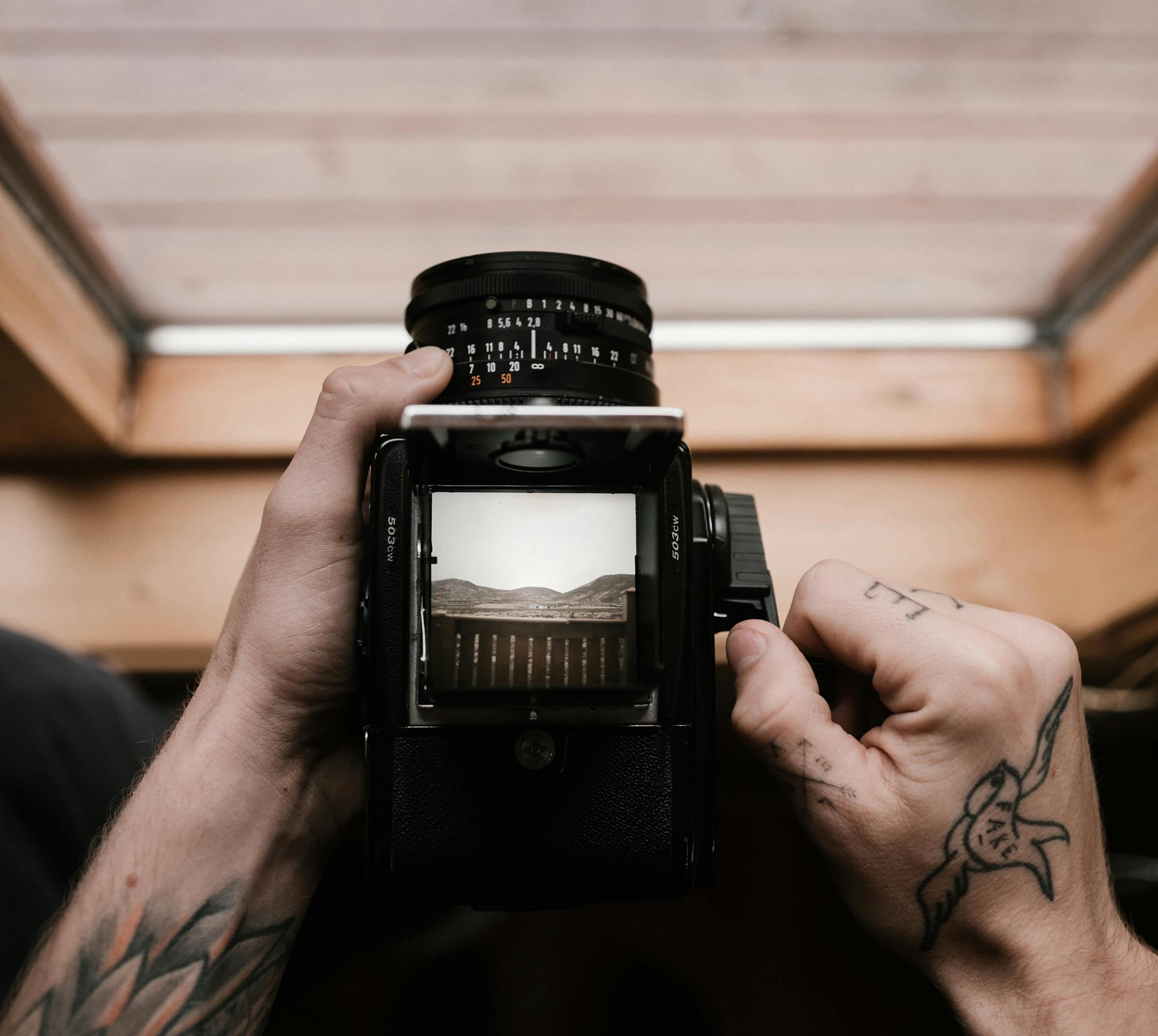 Person Holding Black Nikon Dslr Camera · Free Stock Photo