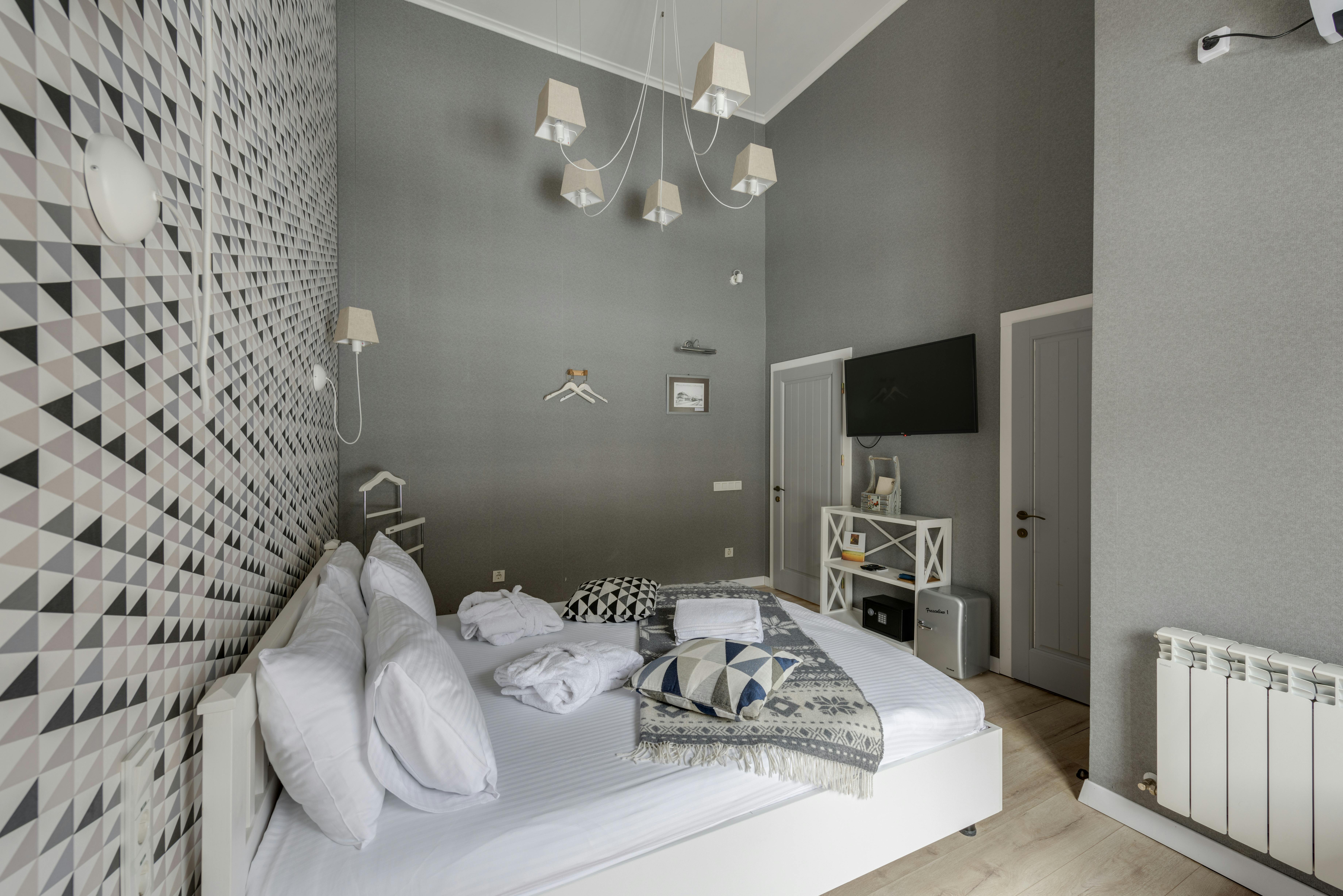 A Gray and White Themed Hotel Bedroom · Free Stock Photo