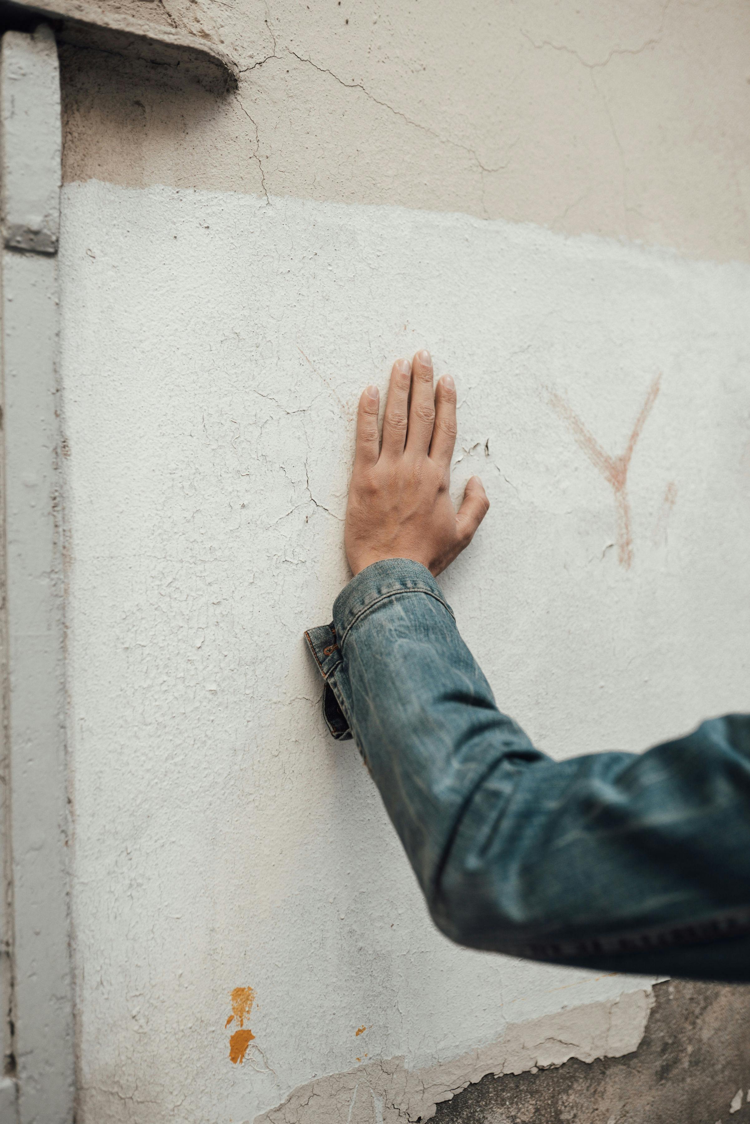 Male Hand on Wall · Free Stock Photo