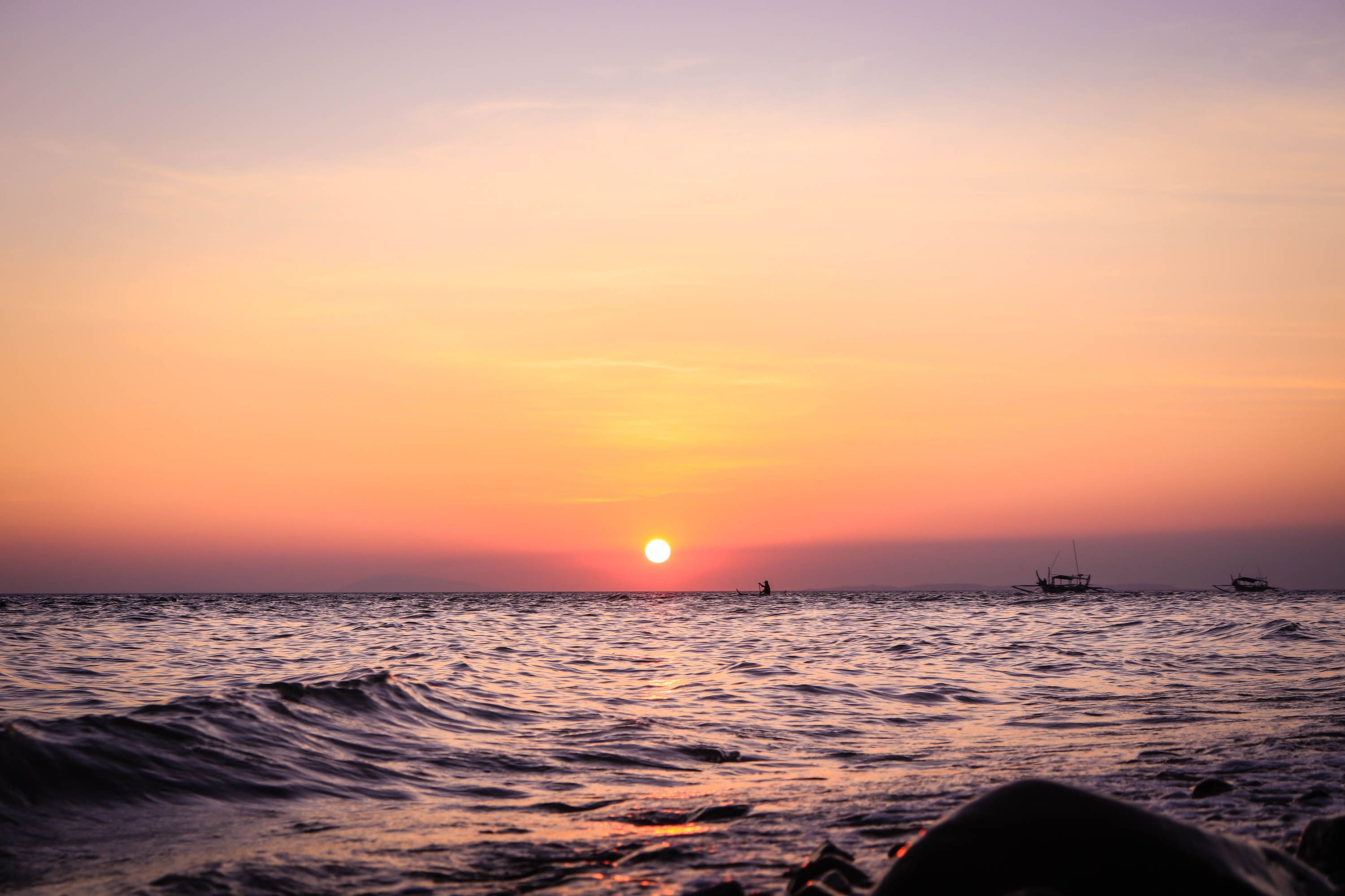 Silhouette of Person on Boat during Sunset · Free Stock Photo
