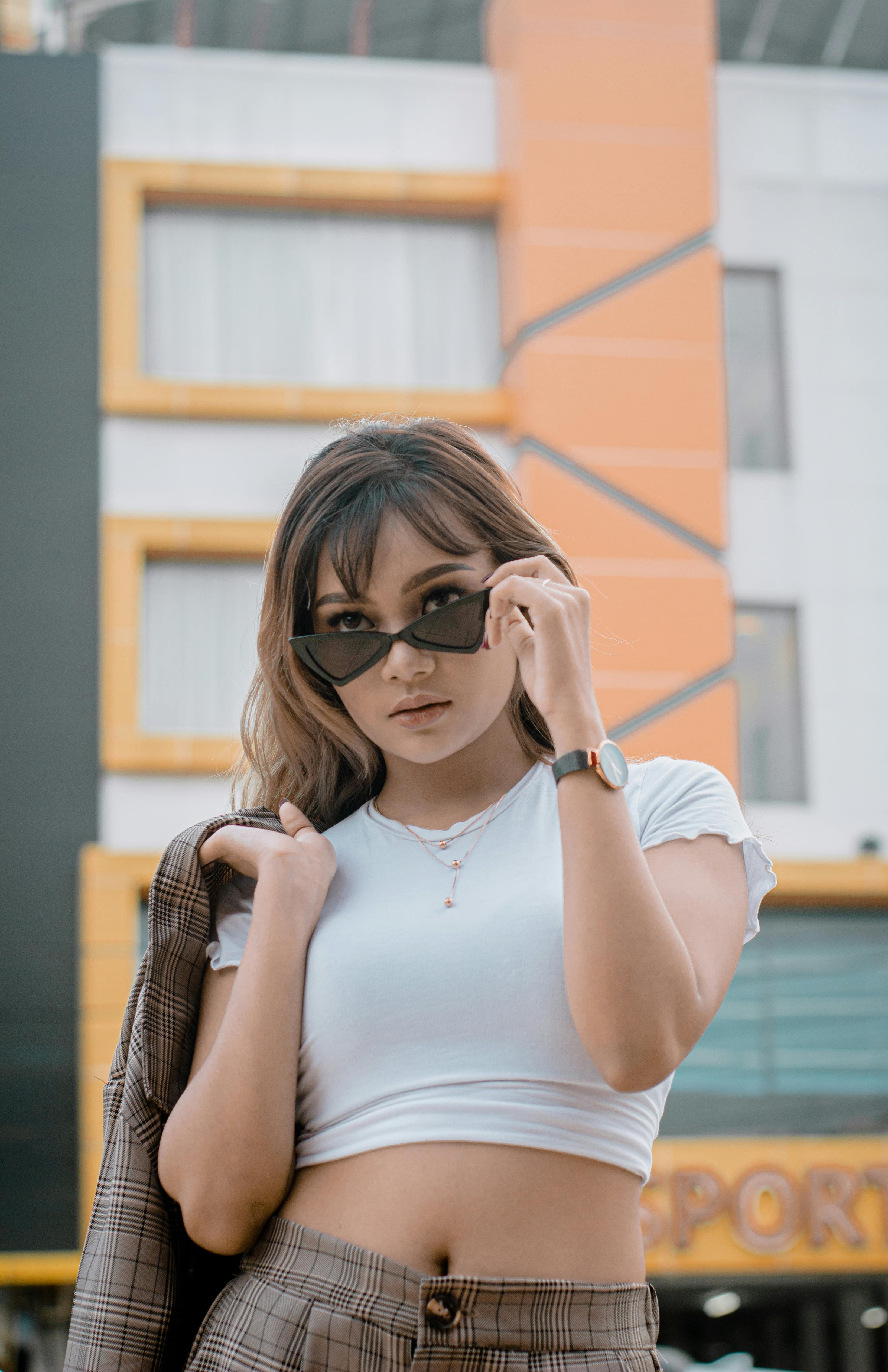Casual Style Model in Cropped Top and Denim Jacket · Free Stock Photo