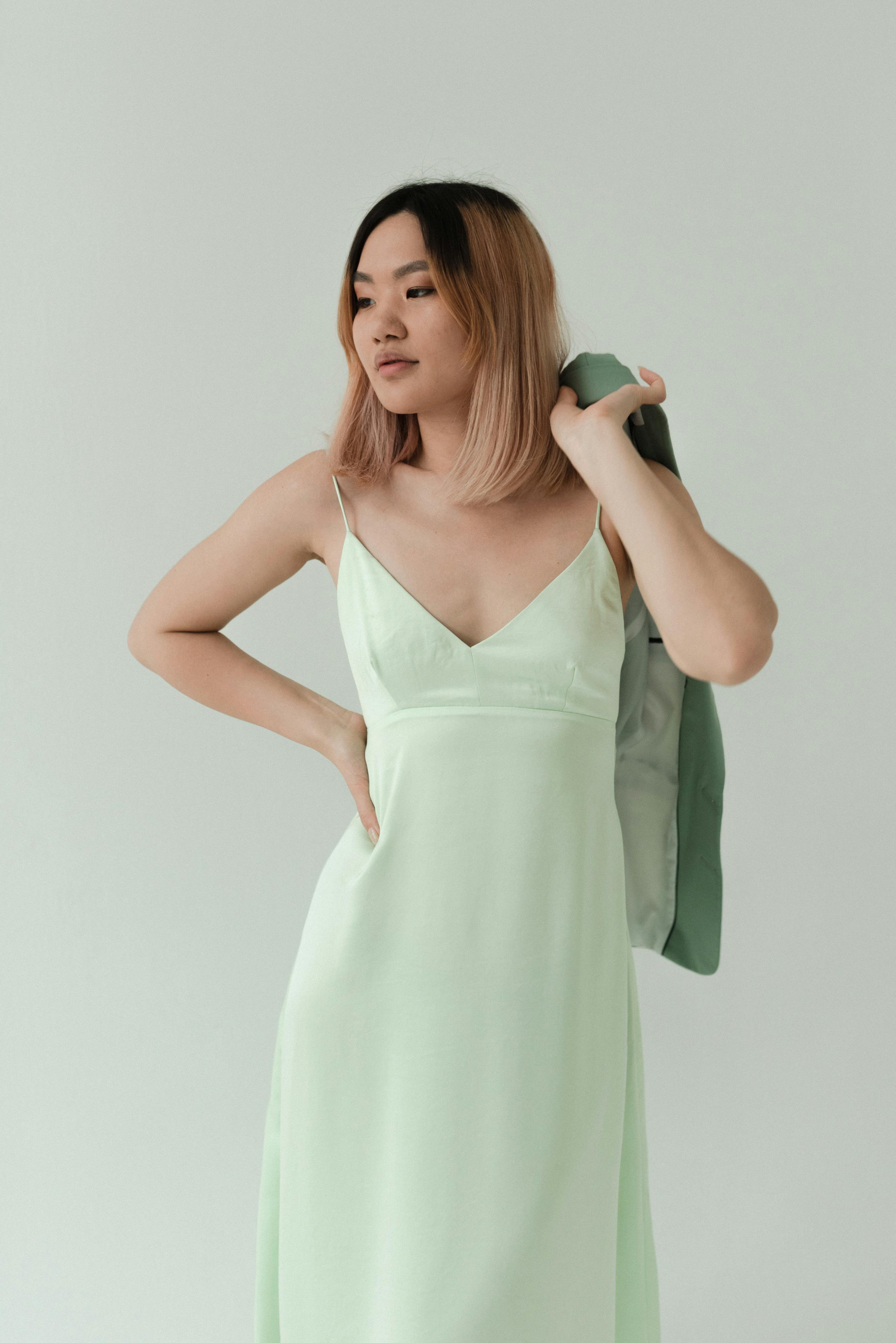 Woman Holding Her Jacket Over Shoulder · Free Stock Photo