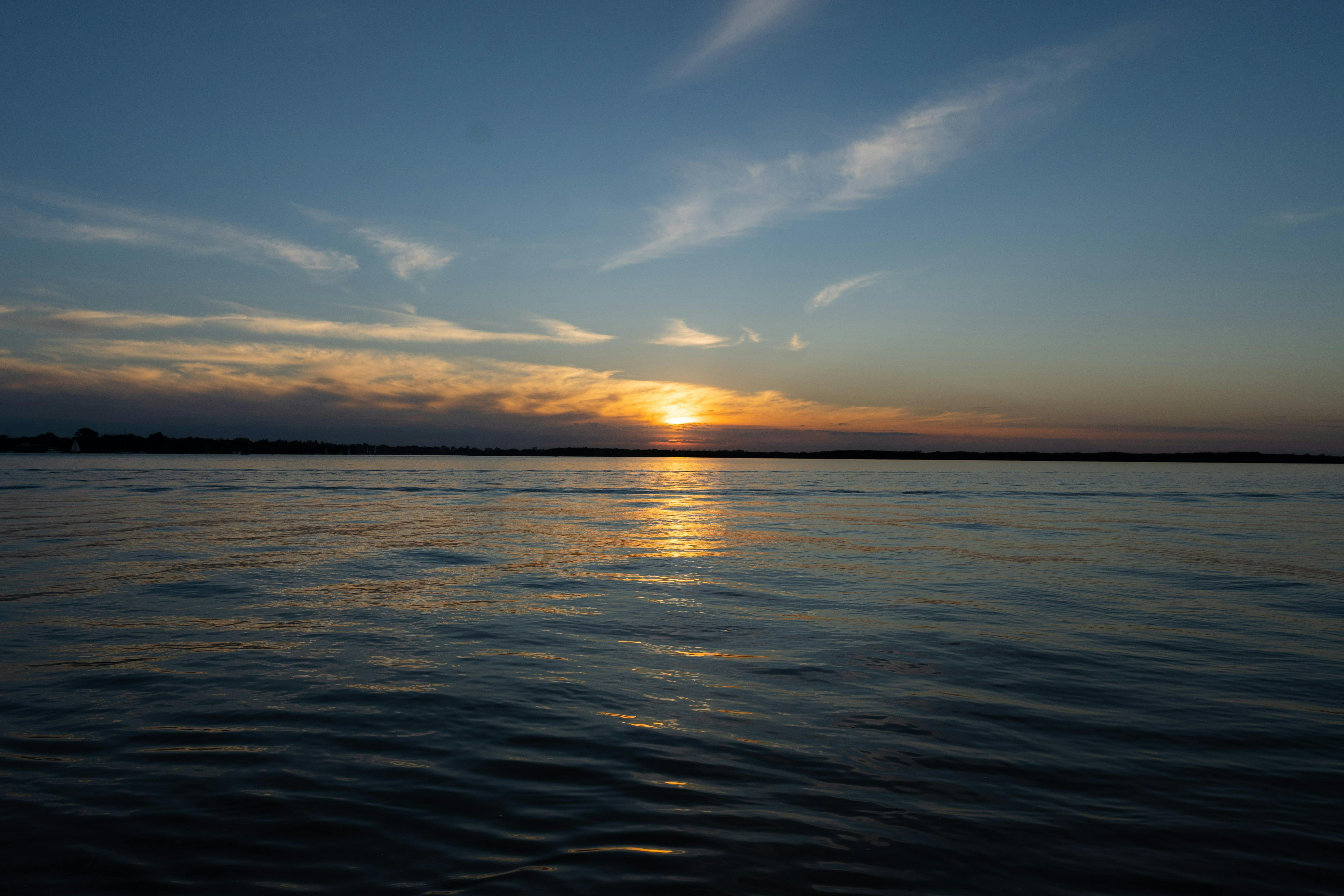 Calm Ocean Under the Clear Blue Sky · Free Stock Photo