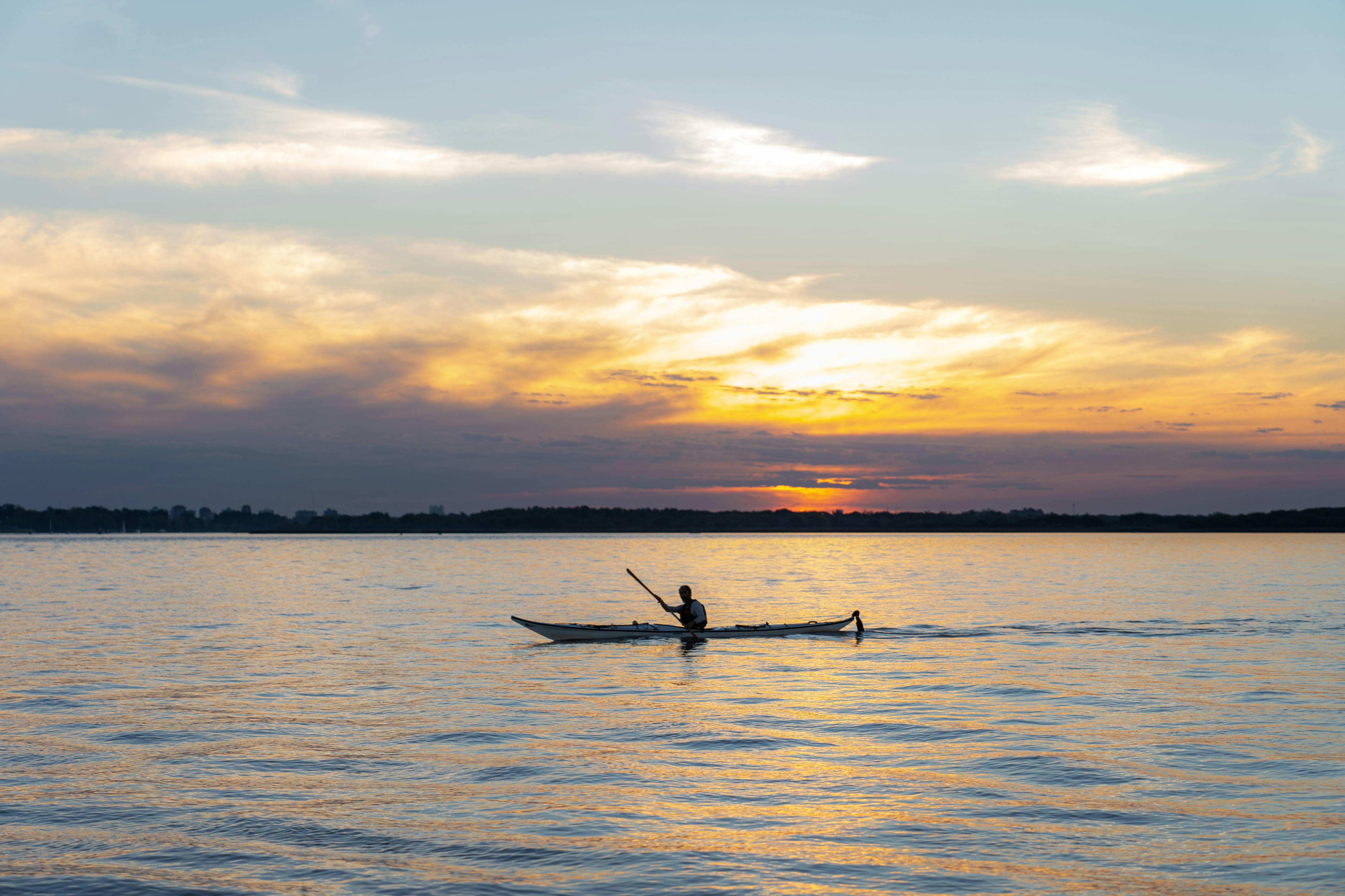 Man Standing On Wooden Boat · Free Stock Photo