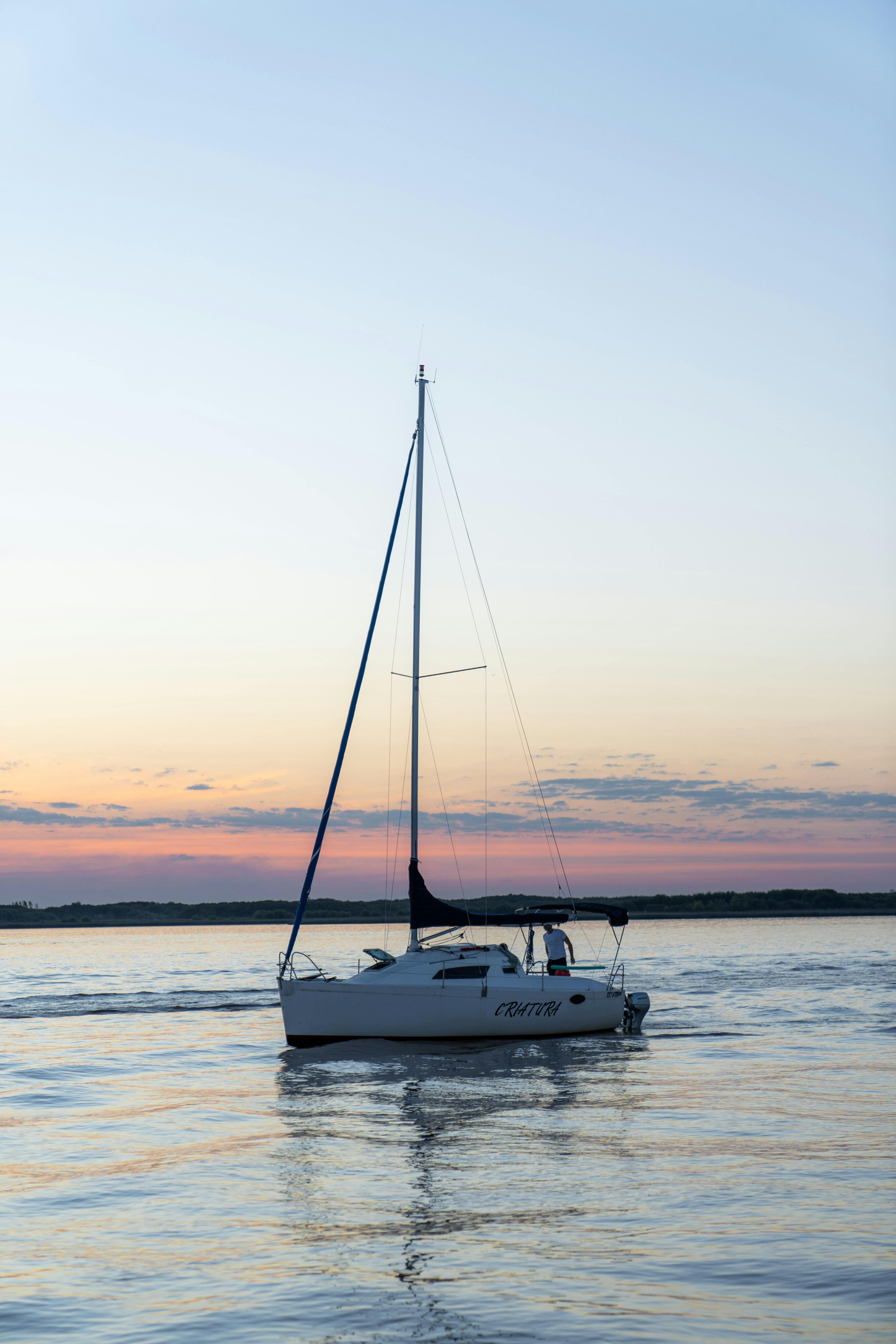 Sailboats in the Ocean During Golden Hour · Free Stock Photo