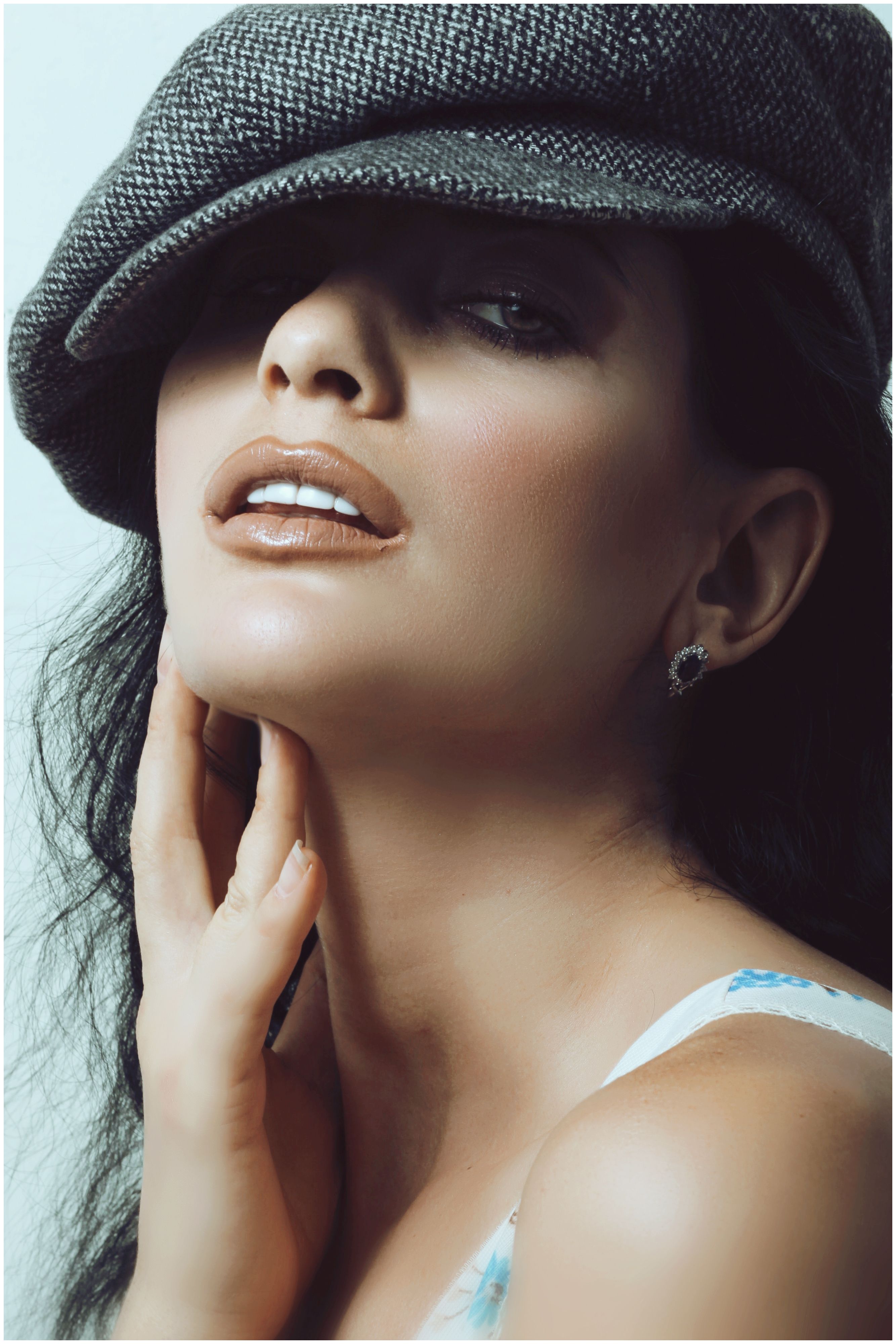 A Woman Wearing Gray Cap · Free Stock Photo