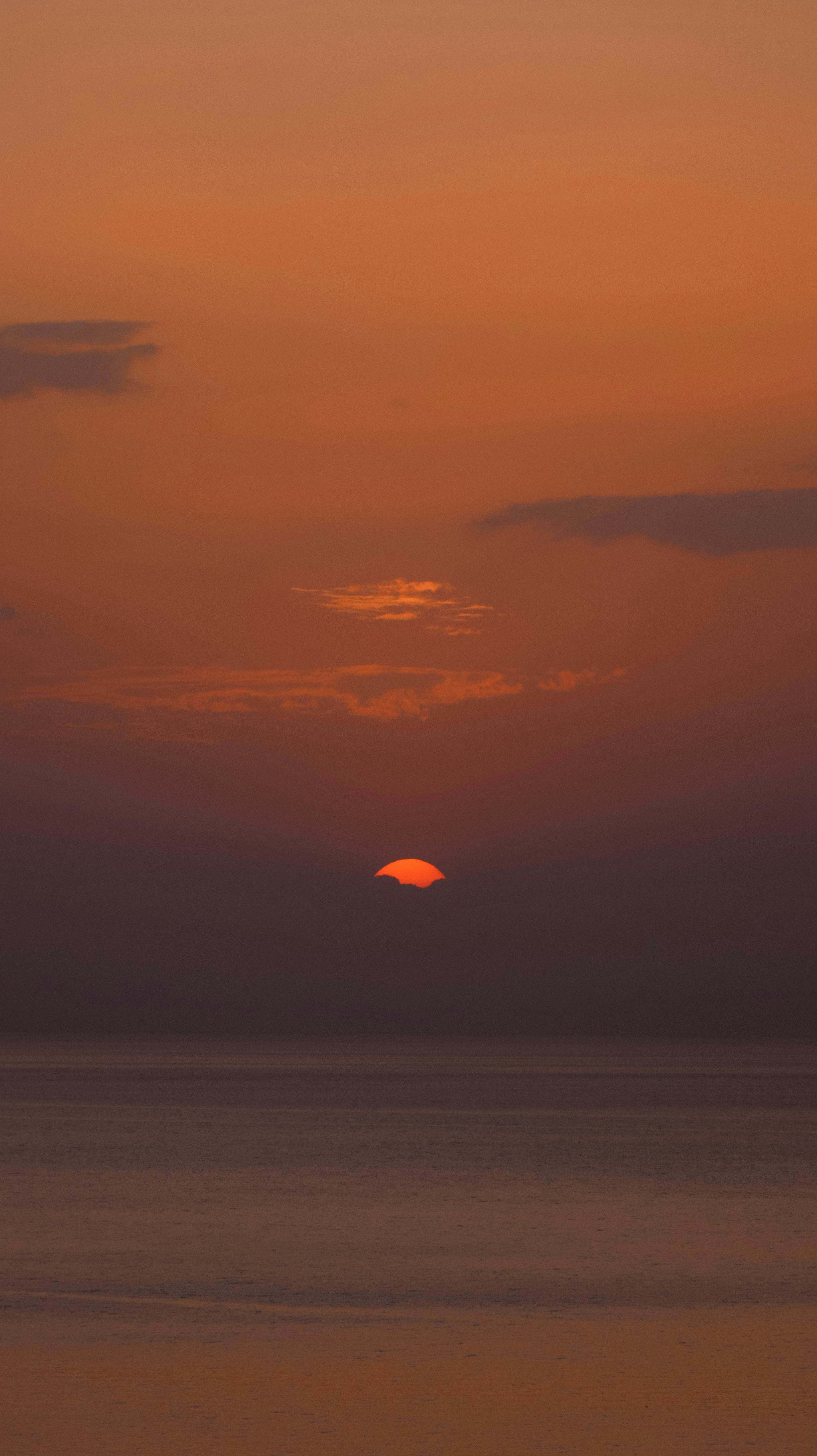 Sunset Over A Body Of Water · Free Stock Photo