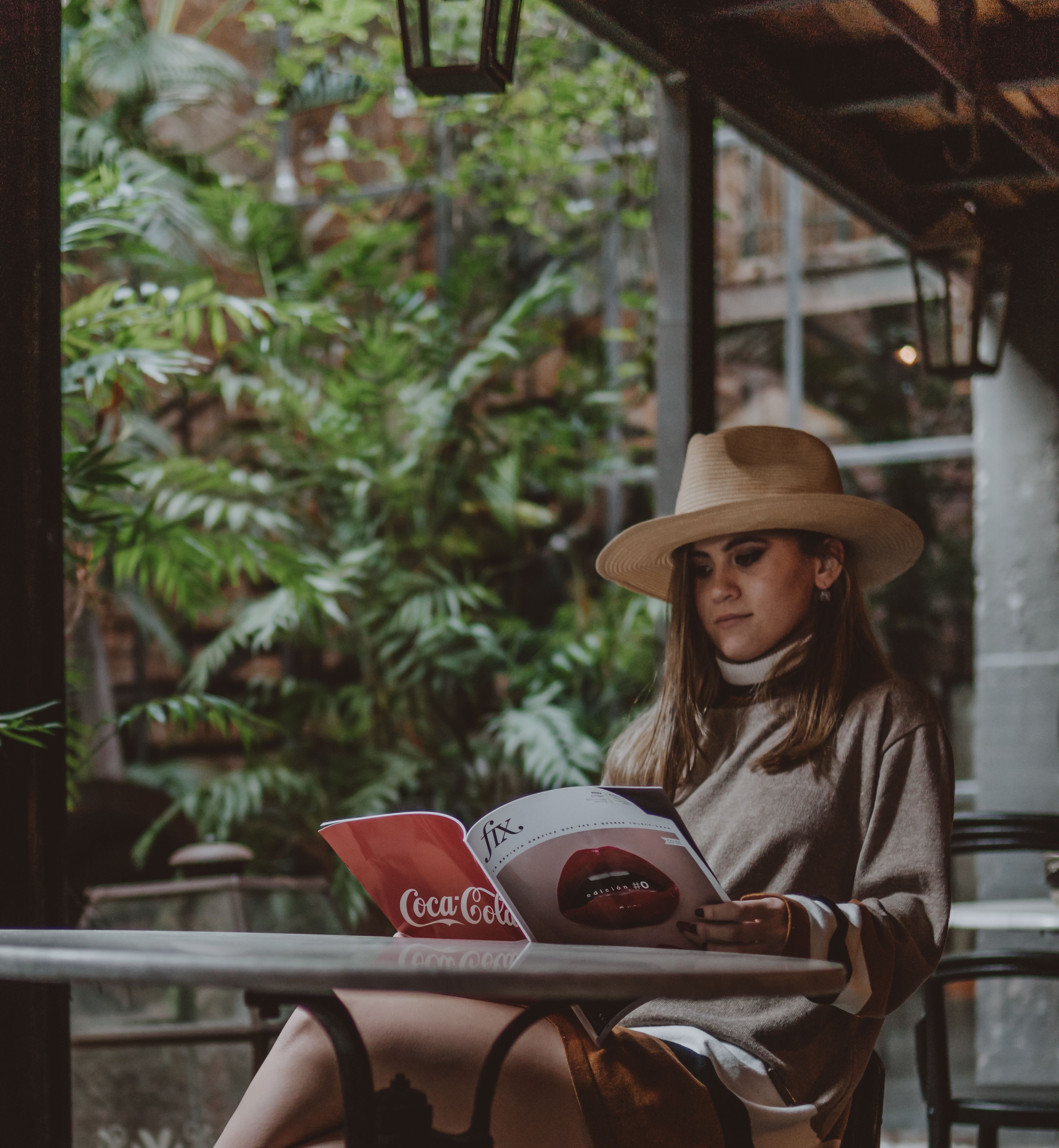Person Reading a Magazine · Free Stock Photo