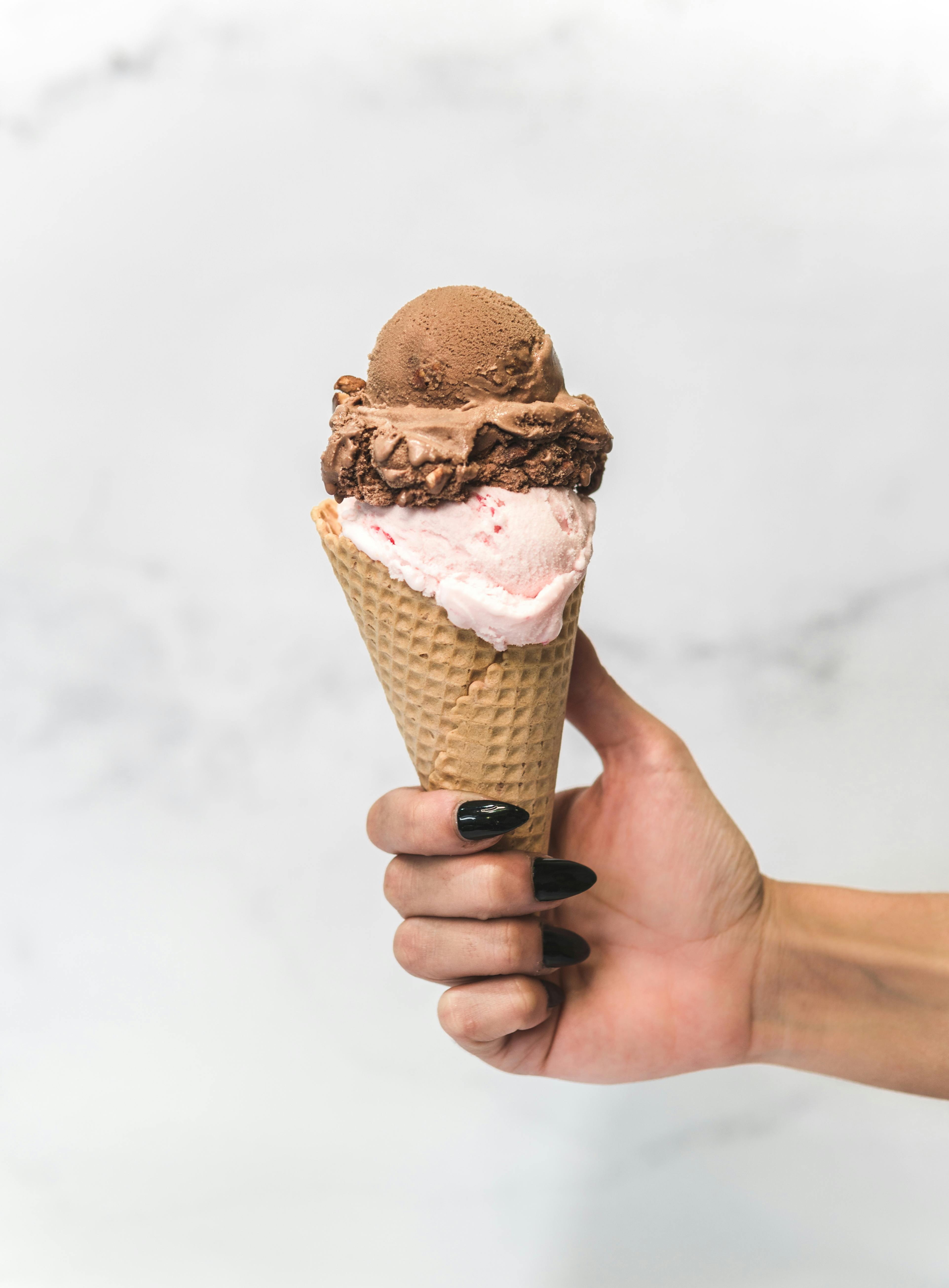 A Person Holding an Ice Cream Cone · Free Stock Photo