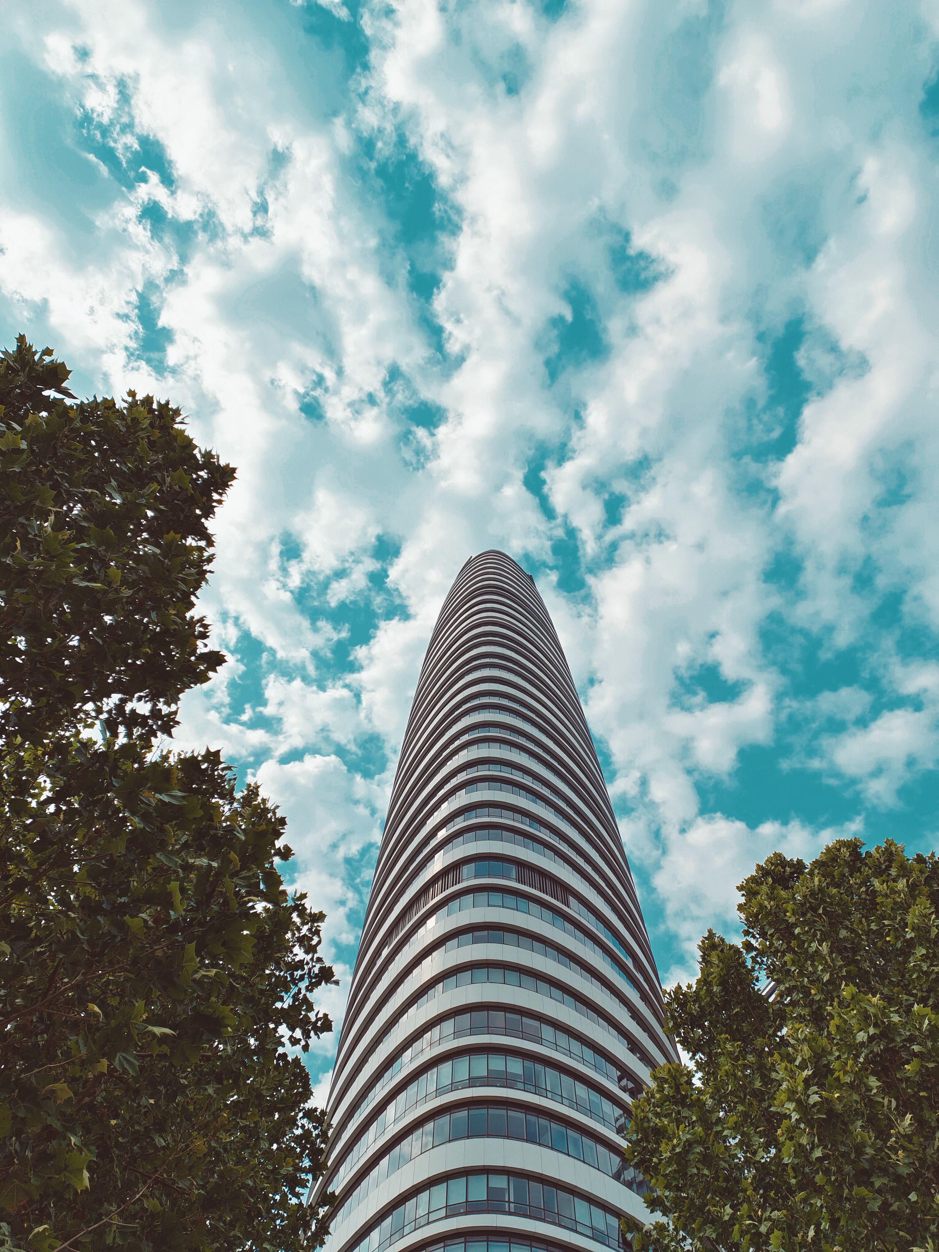 Low-angle Photography of Gray Spiral Building · Free Stock Photo