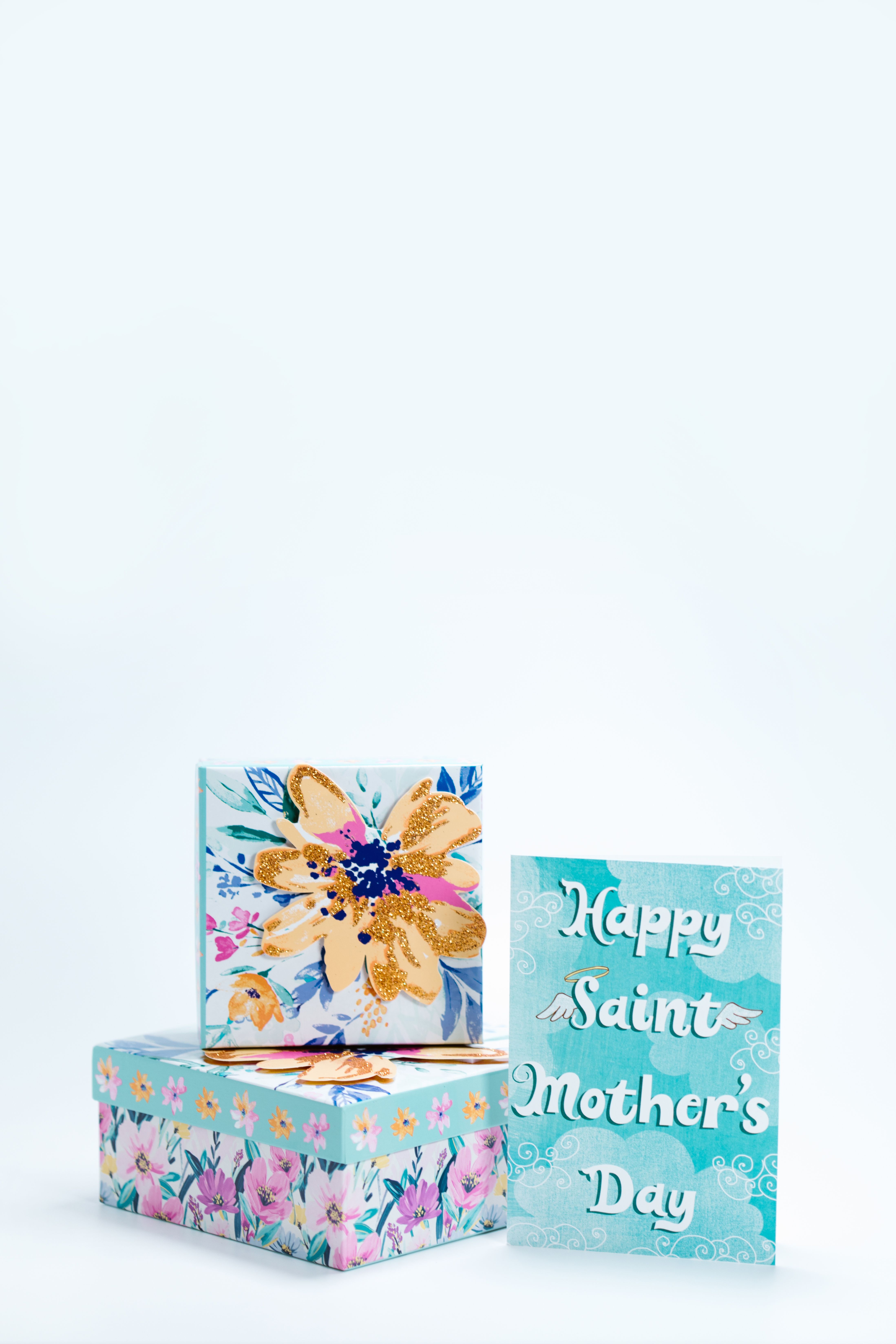 Gift Boxes with Floral Design and a Greeting Card · Free Stock Photo