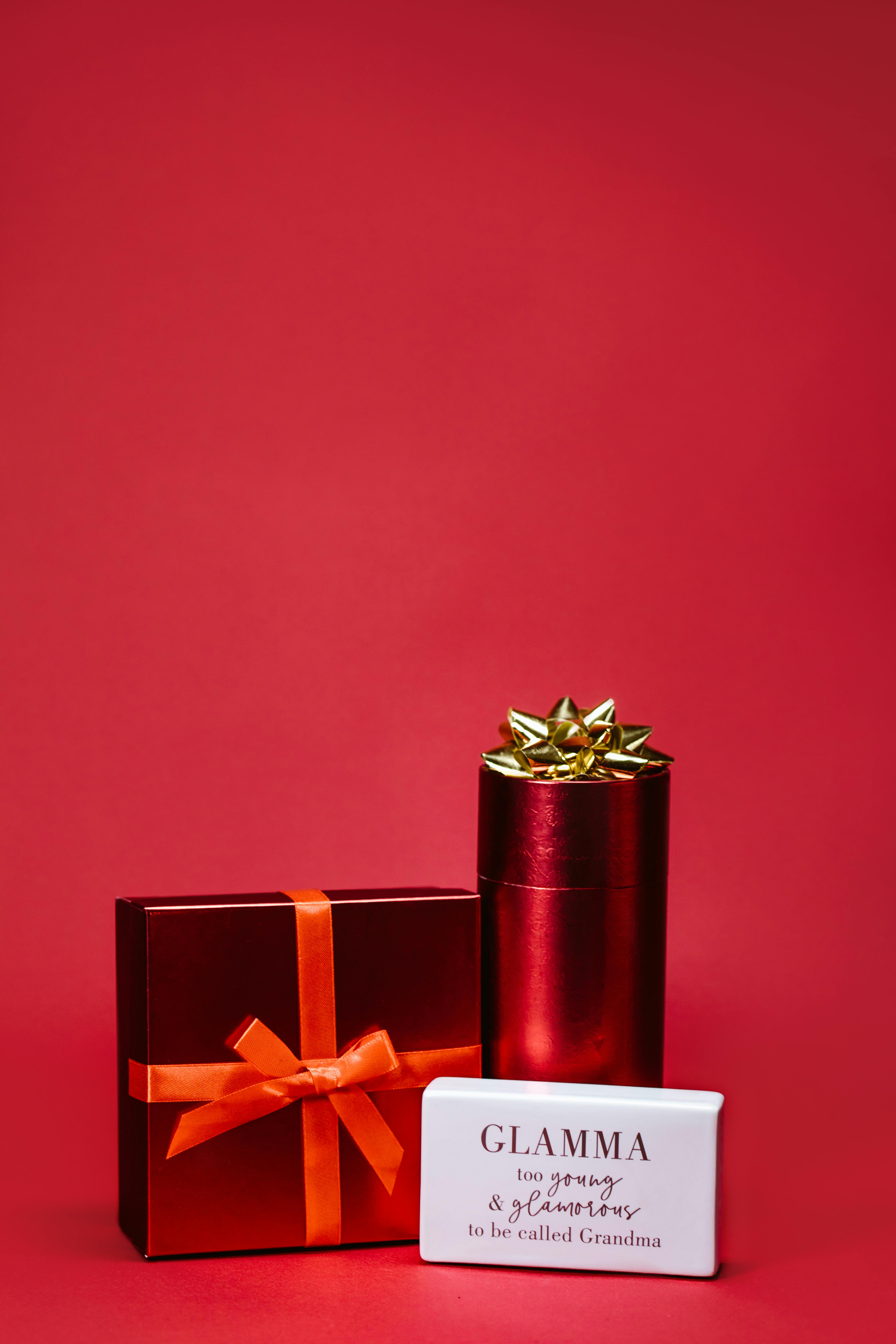 Assorted Gift Boxes on Red Surface · Free Stock Photo