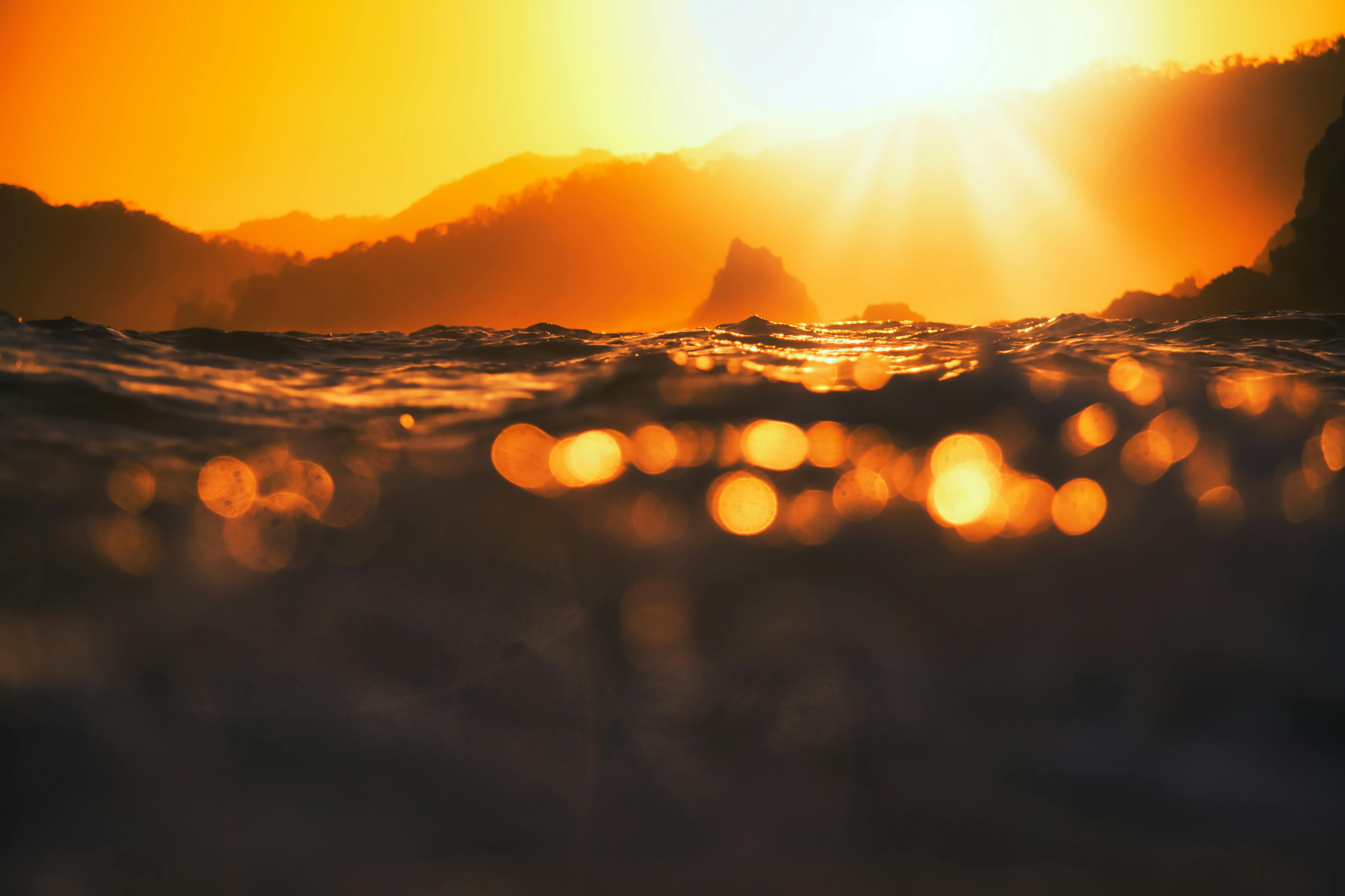 Woman Standing on Shore with Sunshine Reflecting on Water · Free Stock ...