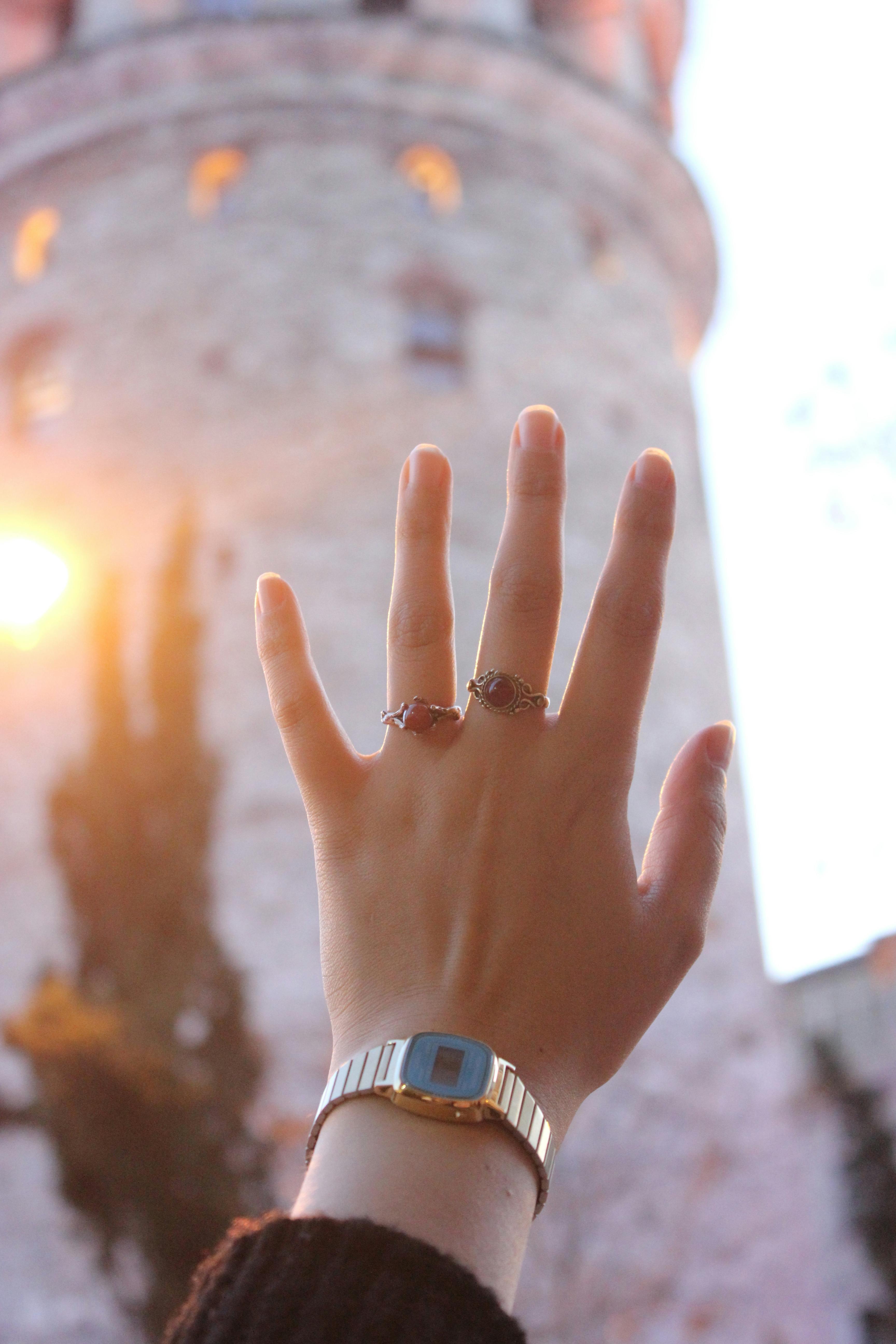 Person's Hand with Silver Rings · Free Stock Photo