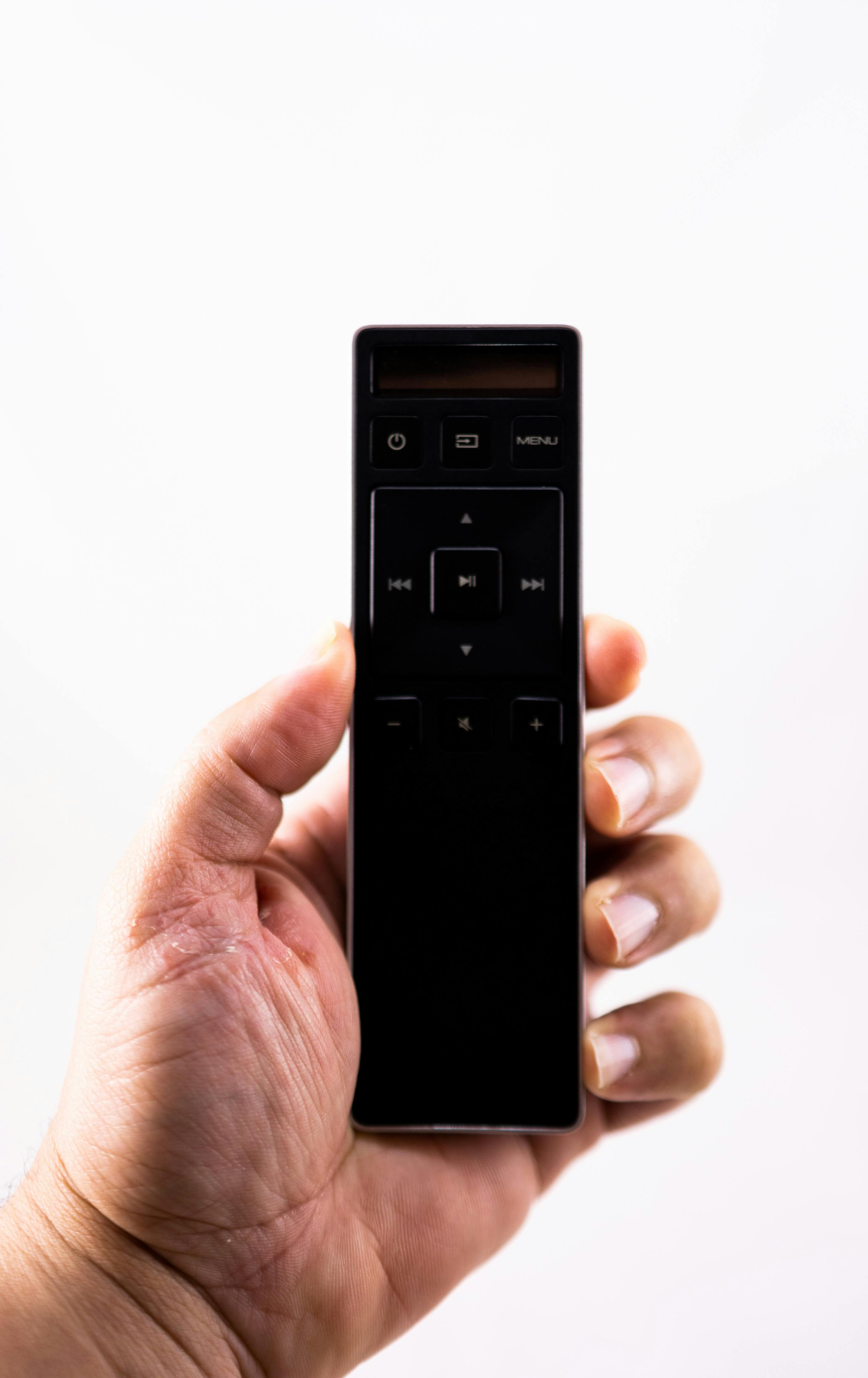 Crop person holding modern clicker · Free Stock Photo