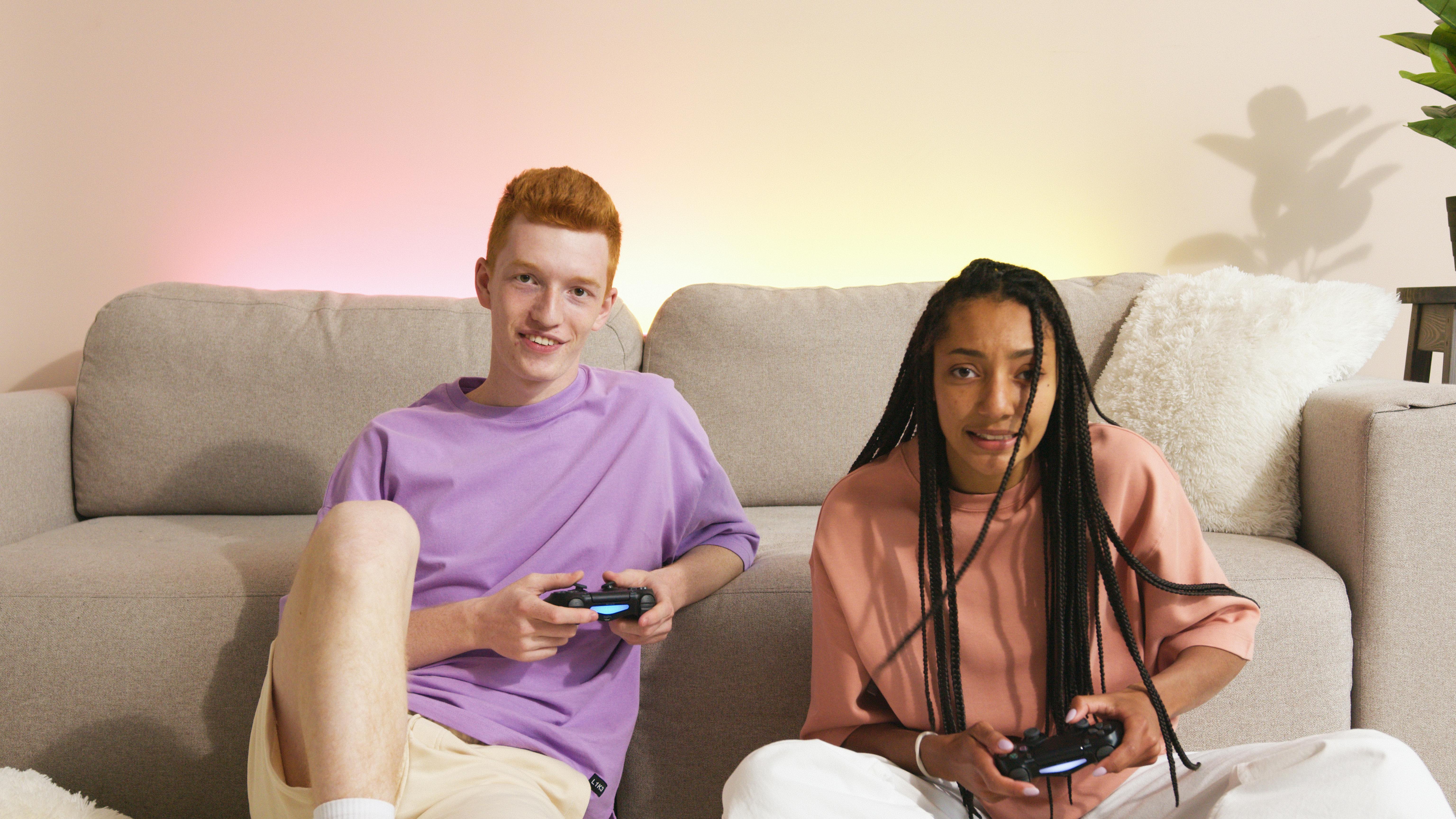 Teenagers Playing Console Game with Wireless Controllers · Free Stock Photo