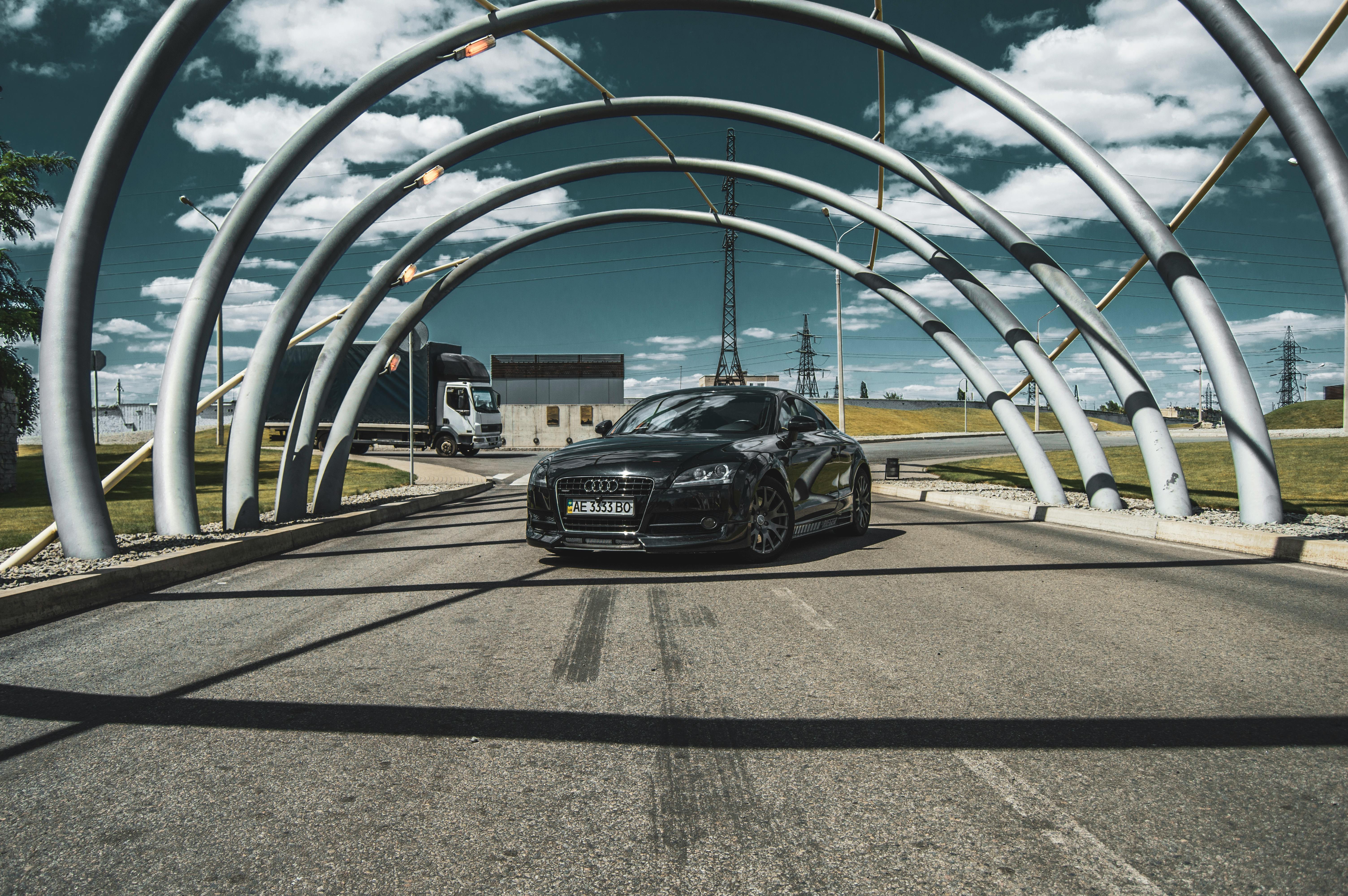 Luxurious Car Parked on Pavement · Free Stock Photo