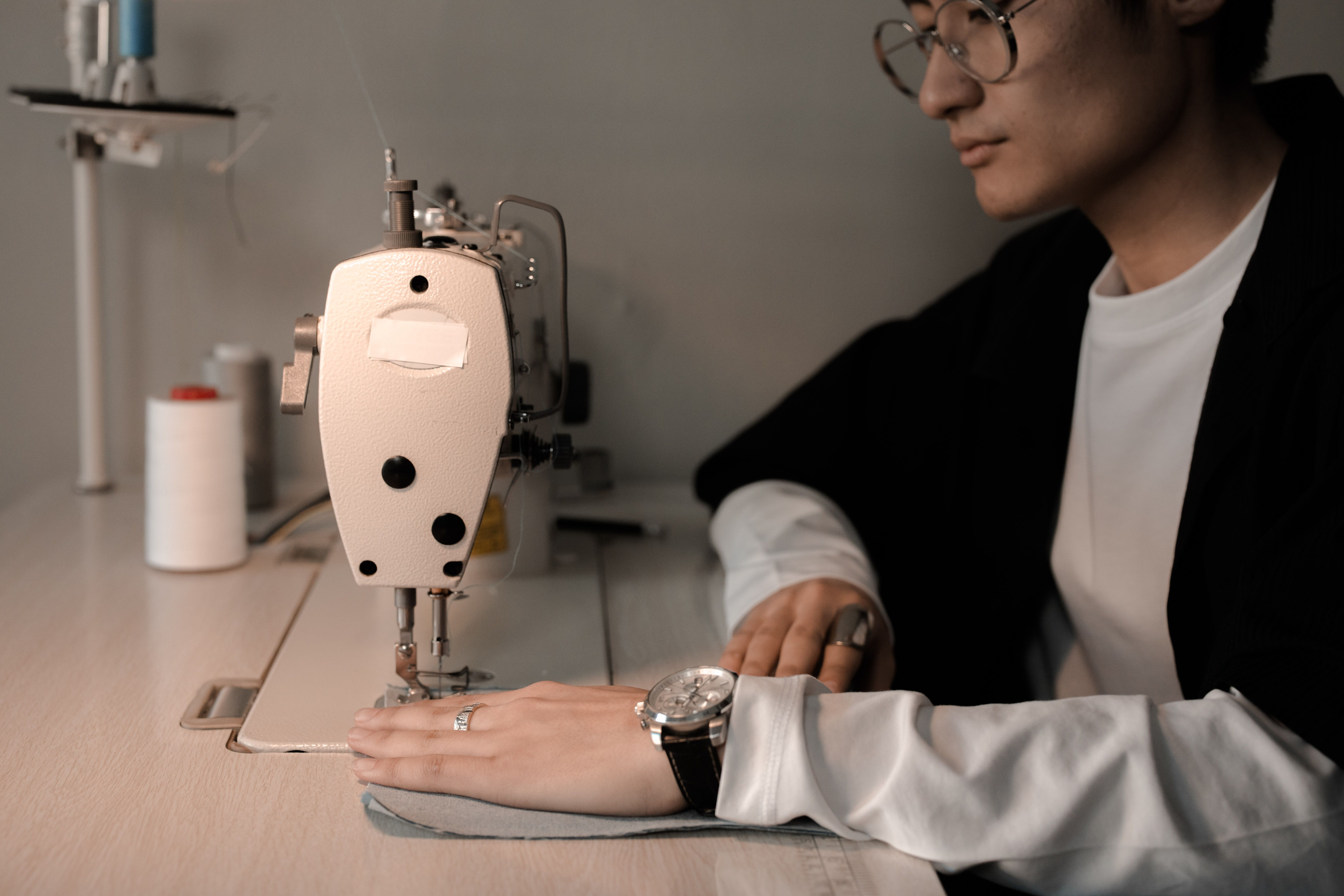 Man Sewing a Fabric · Free Stock Photo