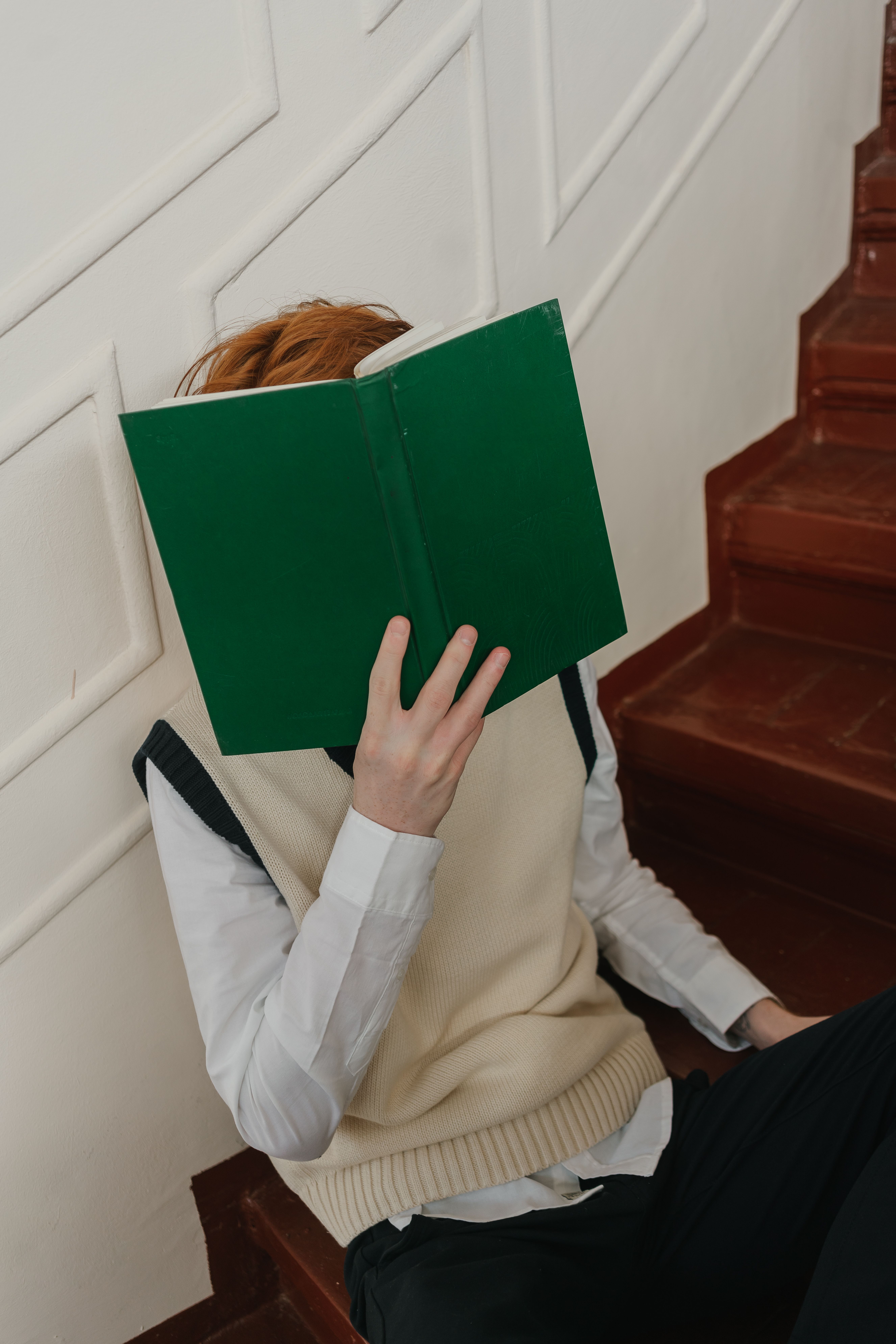 Man Covering his Face with a Book · Free Stock Photo