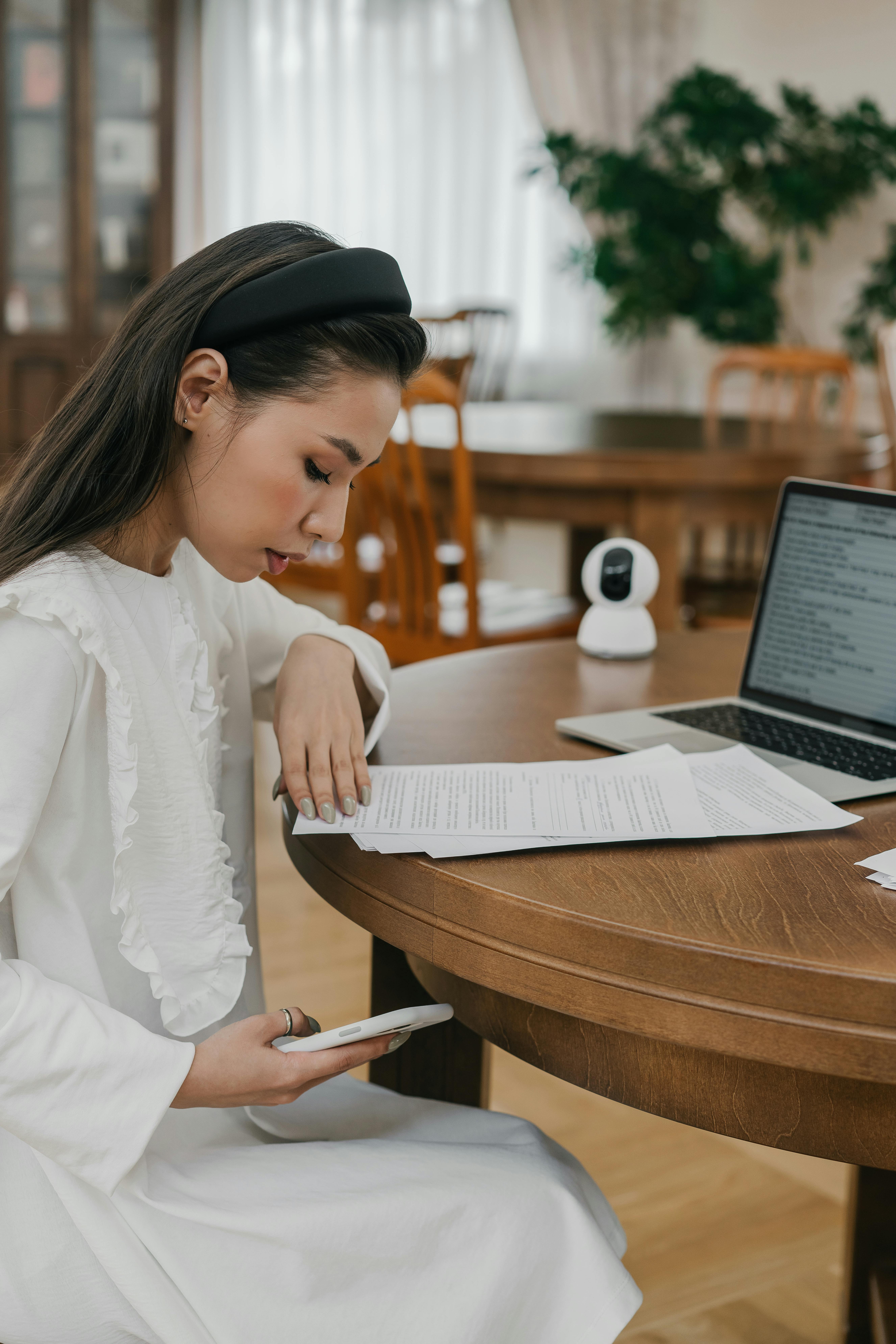 A Student Using a Smartphone under the Table · Free Stock Photo