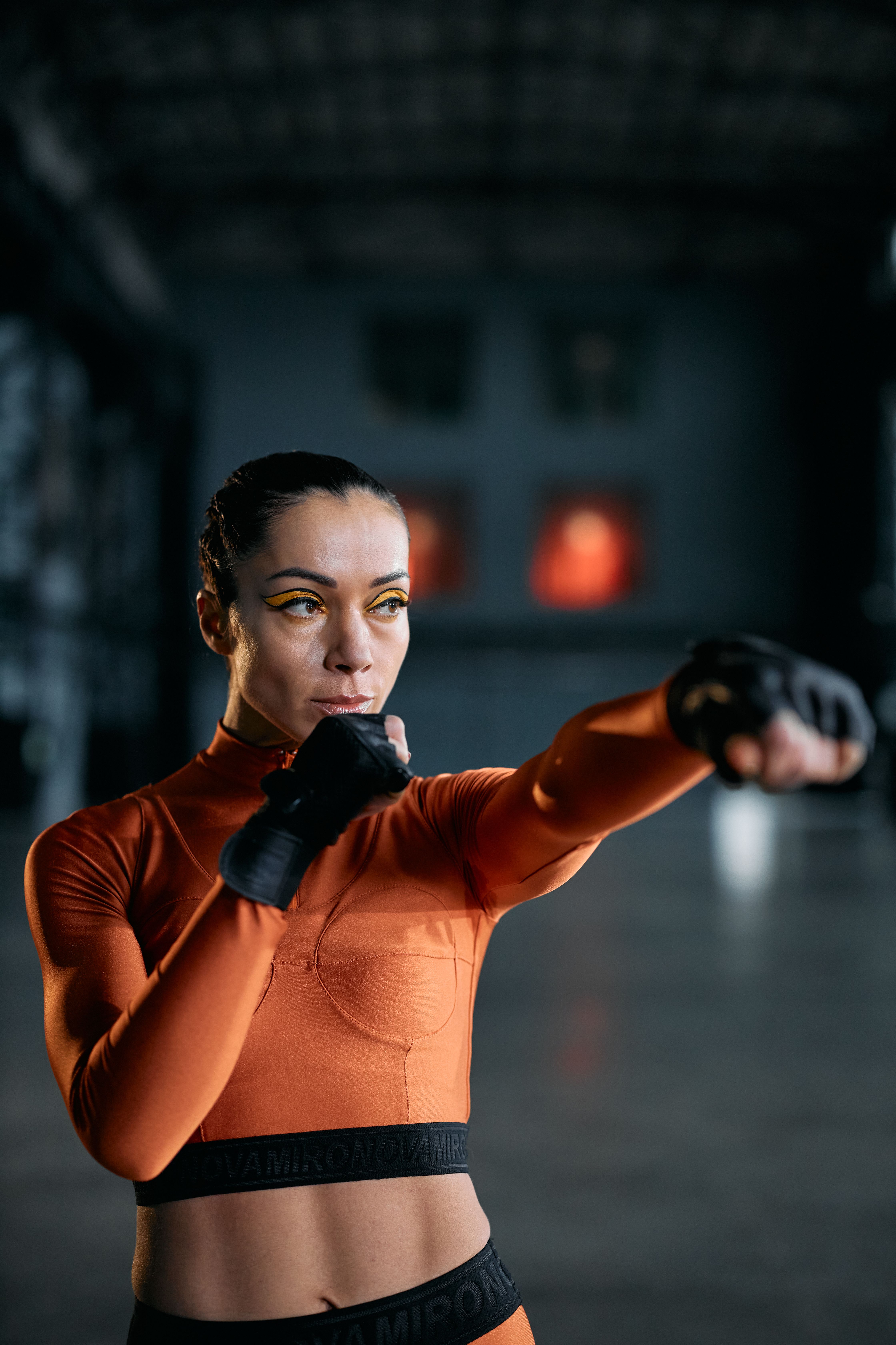 Fighter Woman in Orange Costume · Free Stock Photo