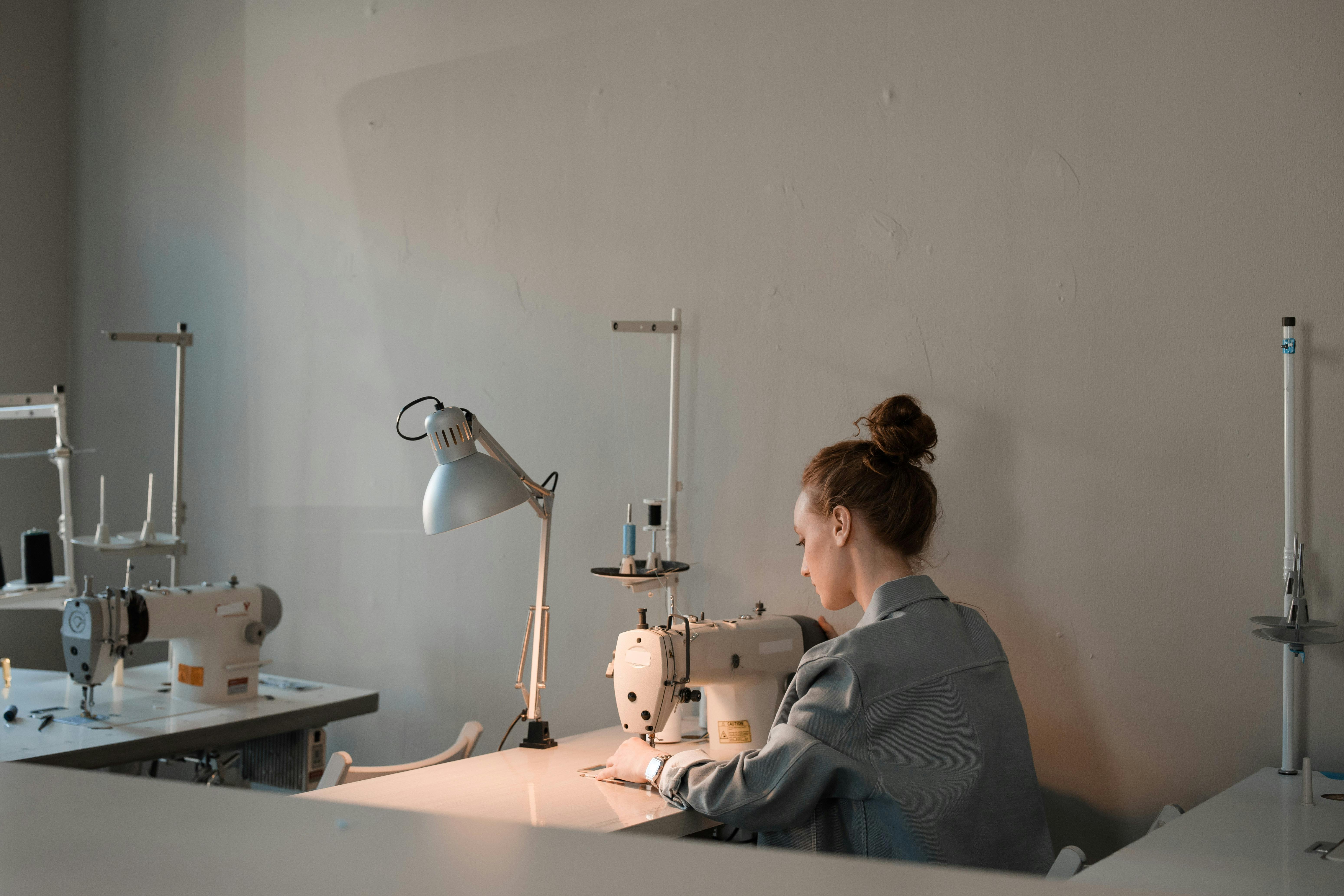 Back View of Woman Sewing · Free Stock Photo