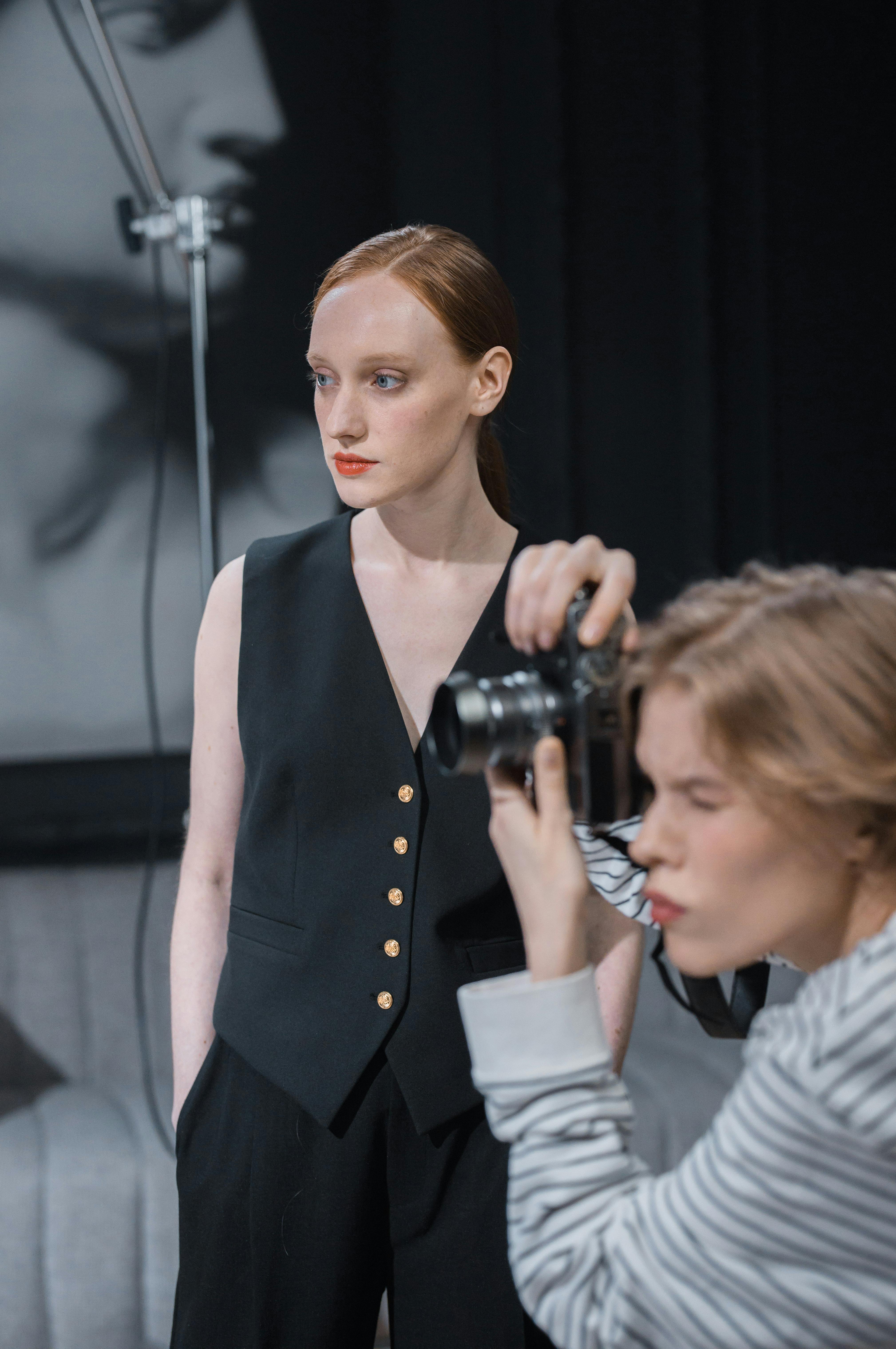 Photographer and a Model in a Photo Session · Free Stock Photo