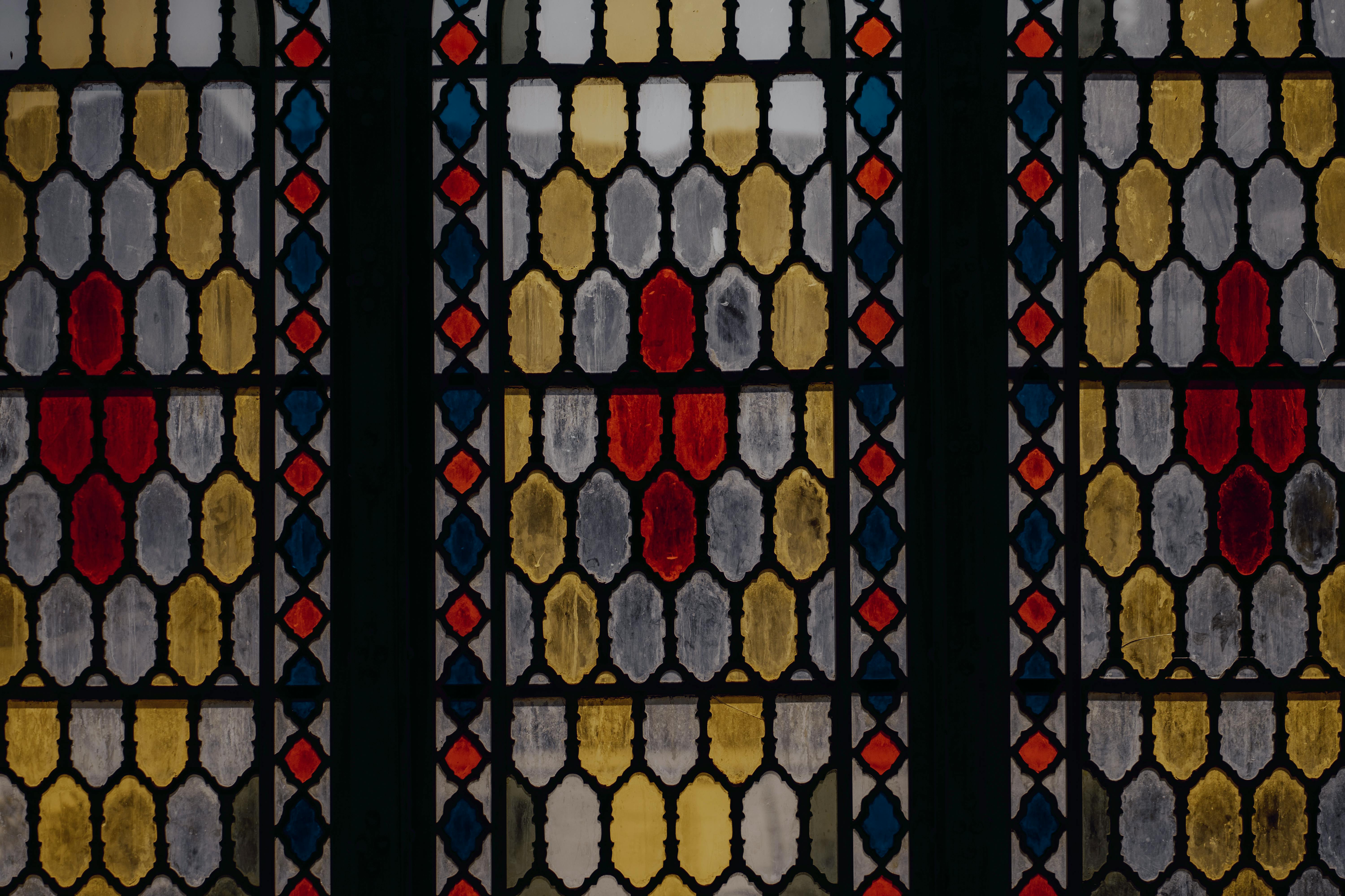 Colorful stained glass window with wooden frame · Free Stock Photo