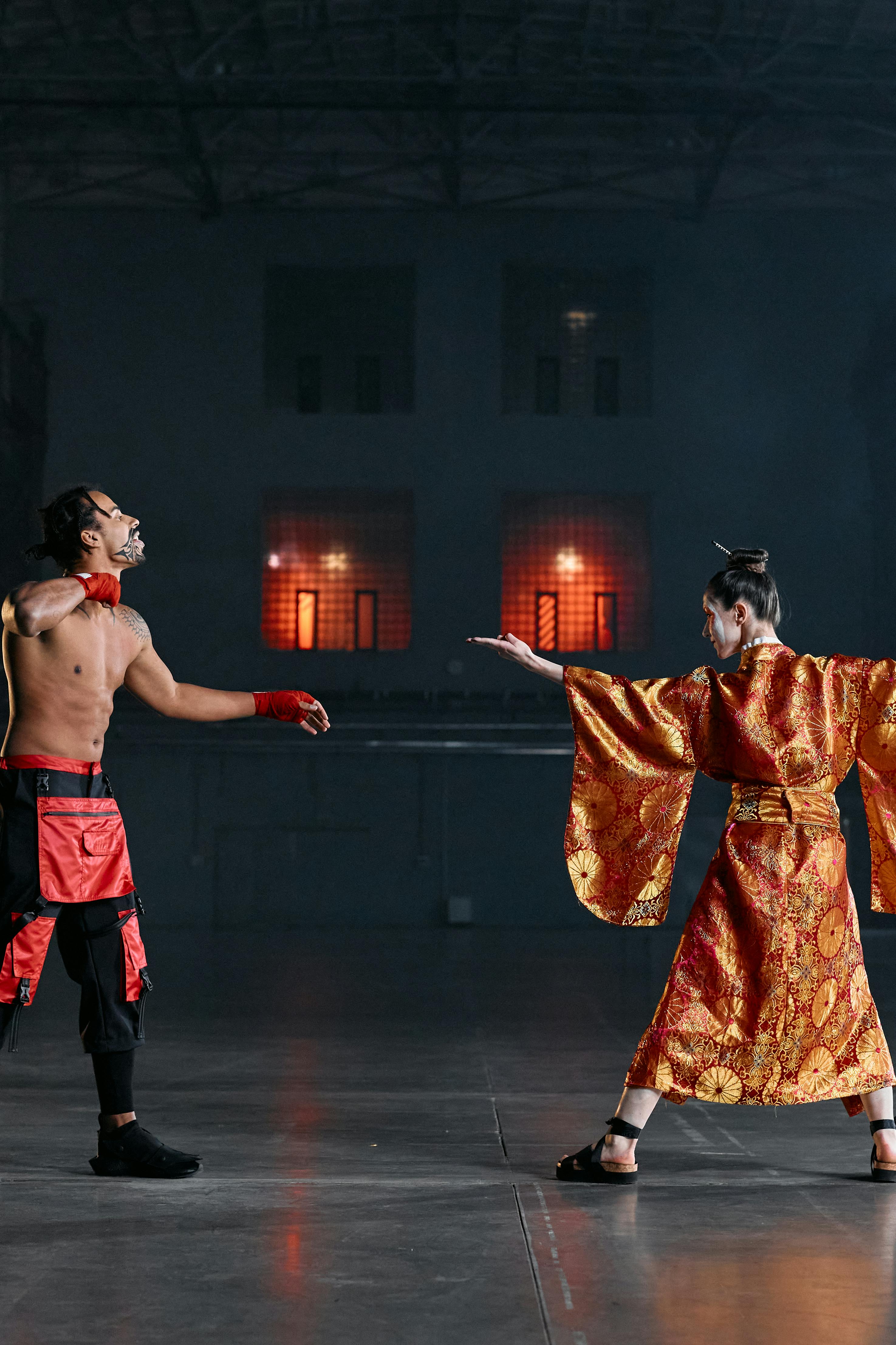 Person in Traditional Wear Sword Fighting a Shirtless Man · Free Stock ...