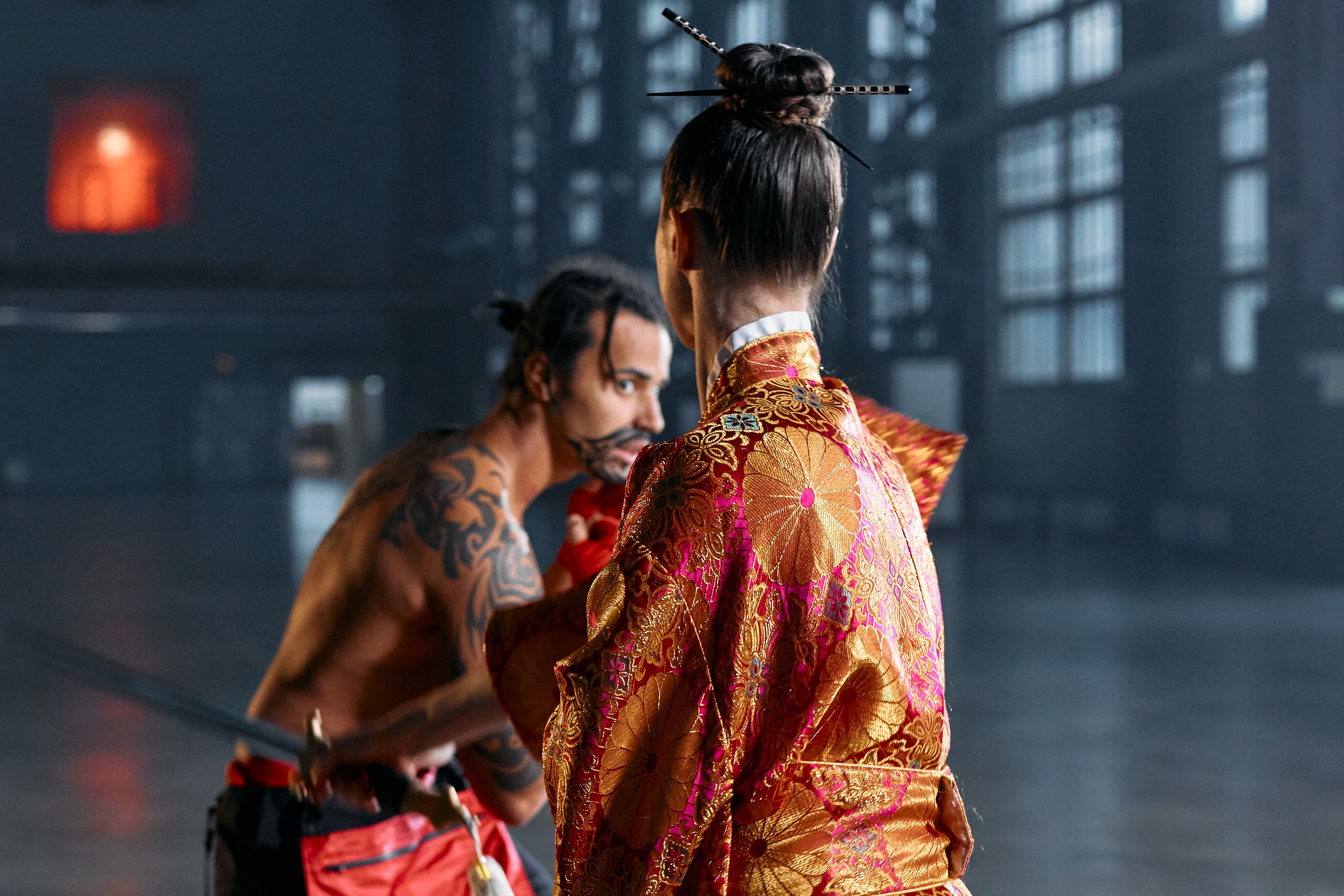 Person in Traditional Wear Sword Fighting a Shirtless Man · Free Stock ...