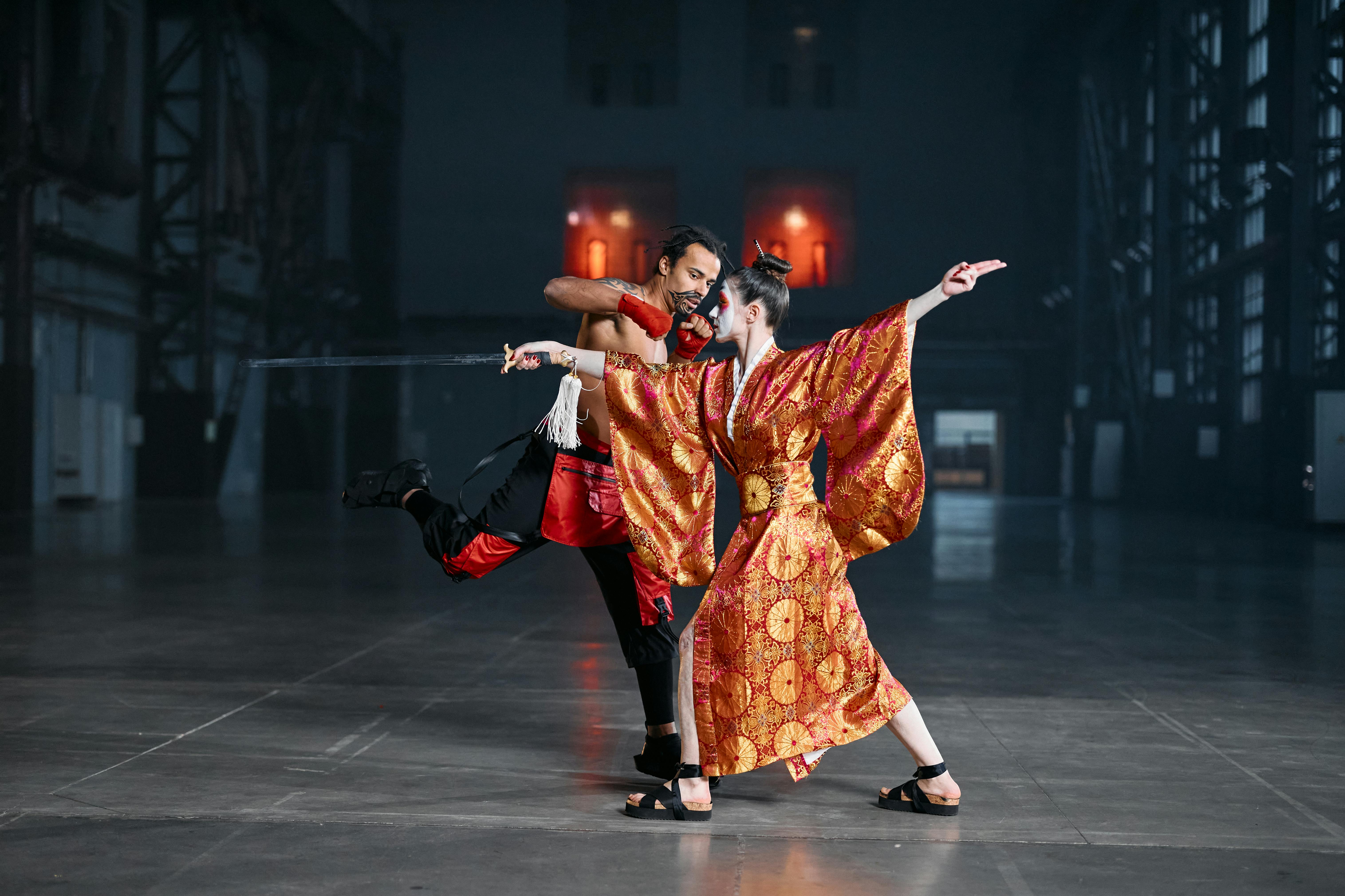 Person in Traditional Wear Sword Fighting a Shirtless Man · Free Stock ...