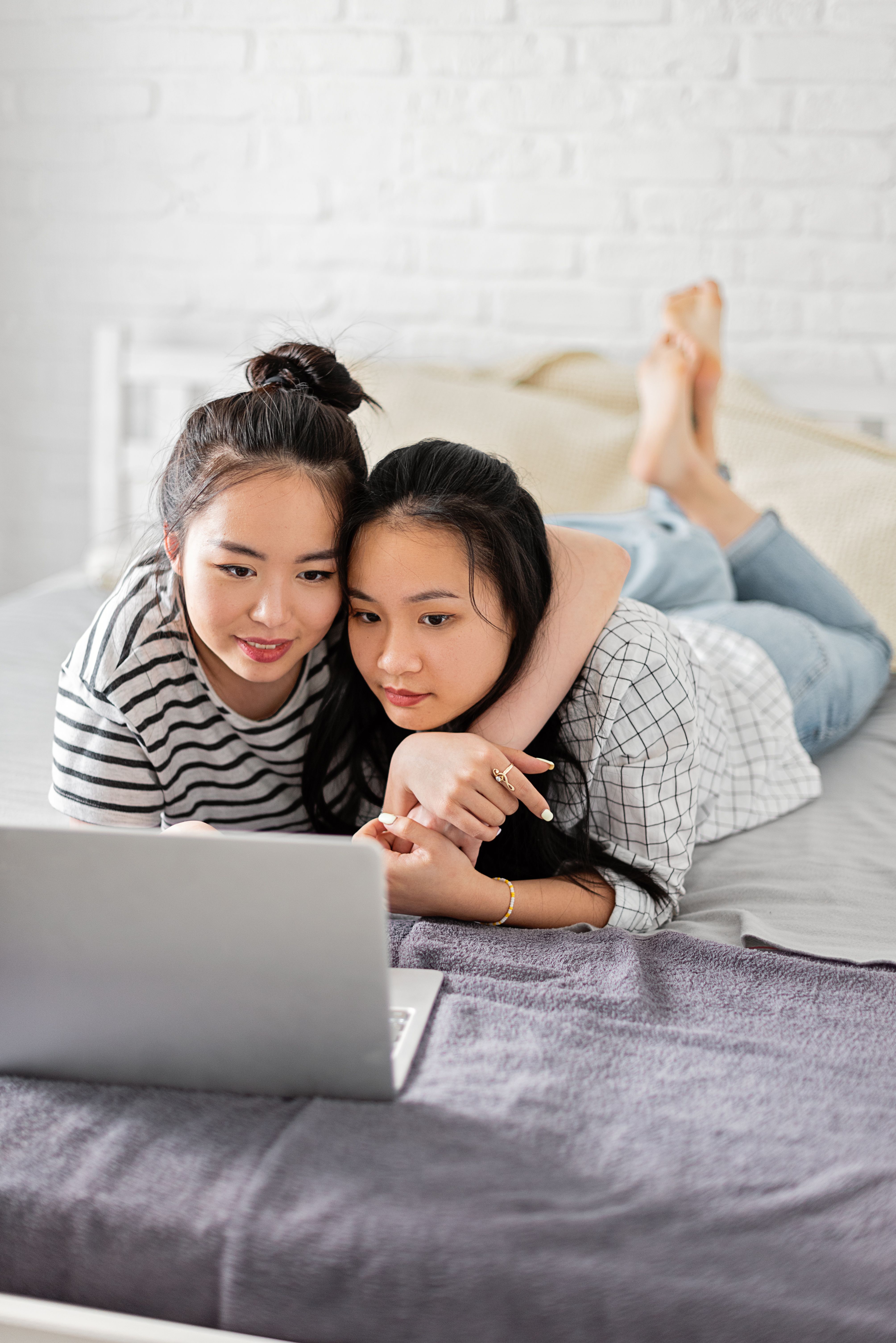 A Couple Hugging while Lying Down · Free Stock Photo