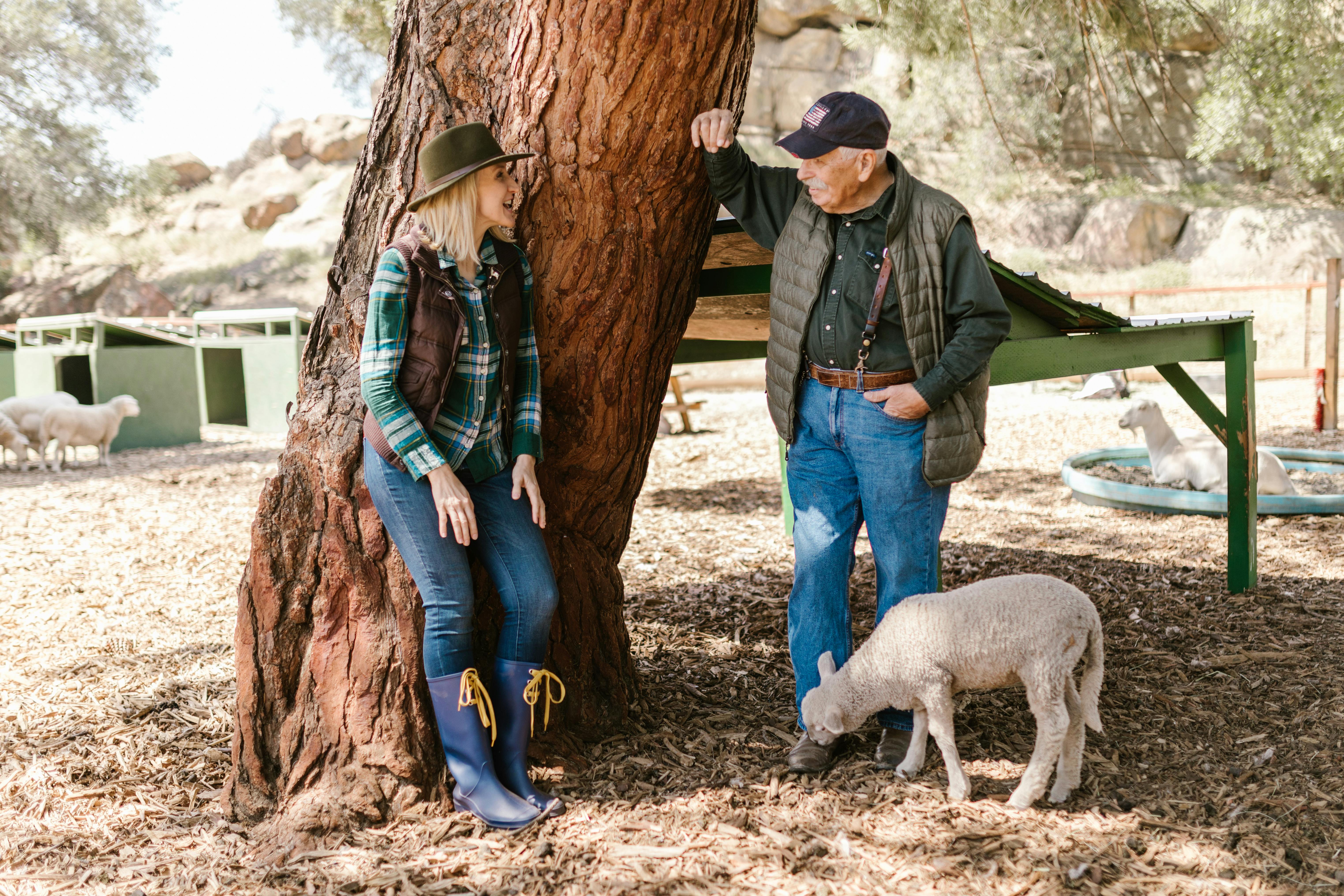 Two People standing under a Tree · Free Stock Photo