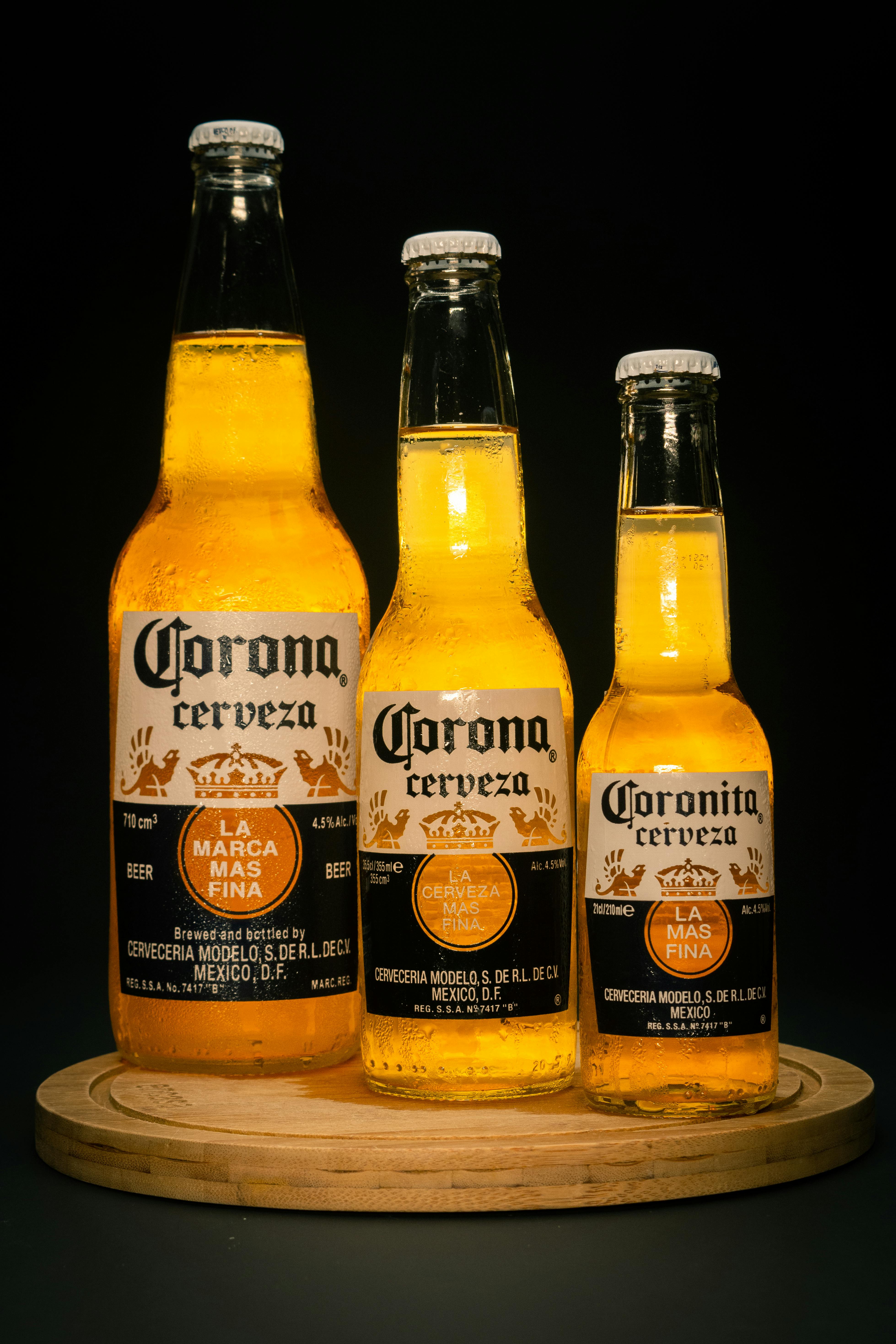 Corona Extra Beer Bottles on Black Background · Free Stock Photo