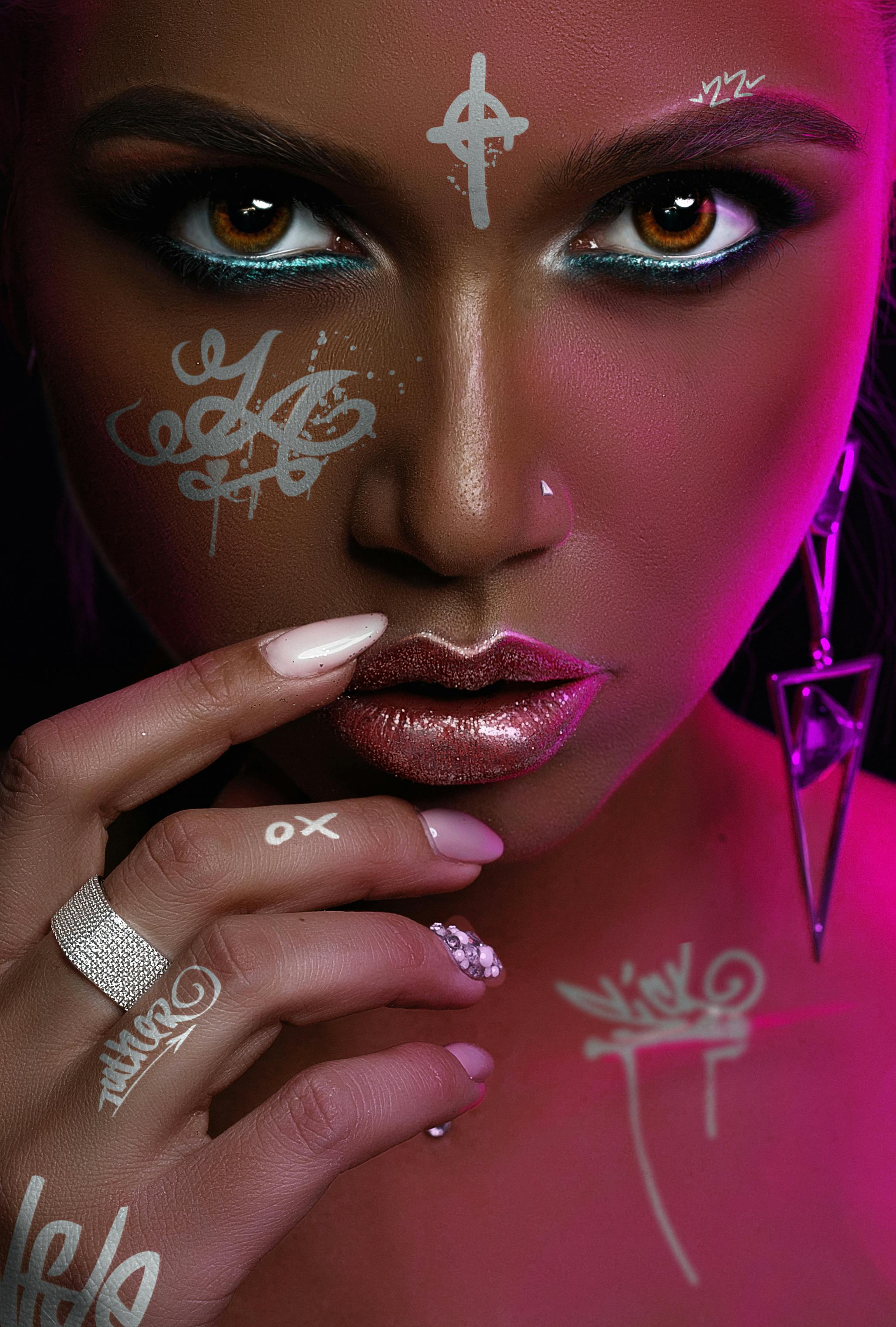 Emotionless young lady with smears on painted face looking away in ...