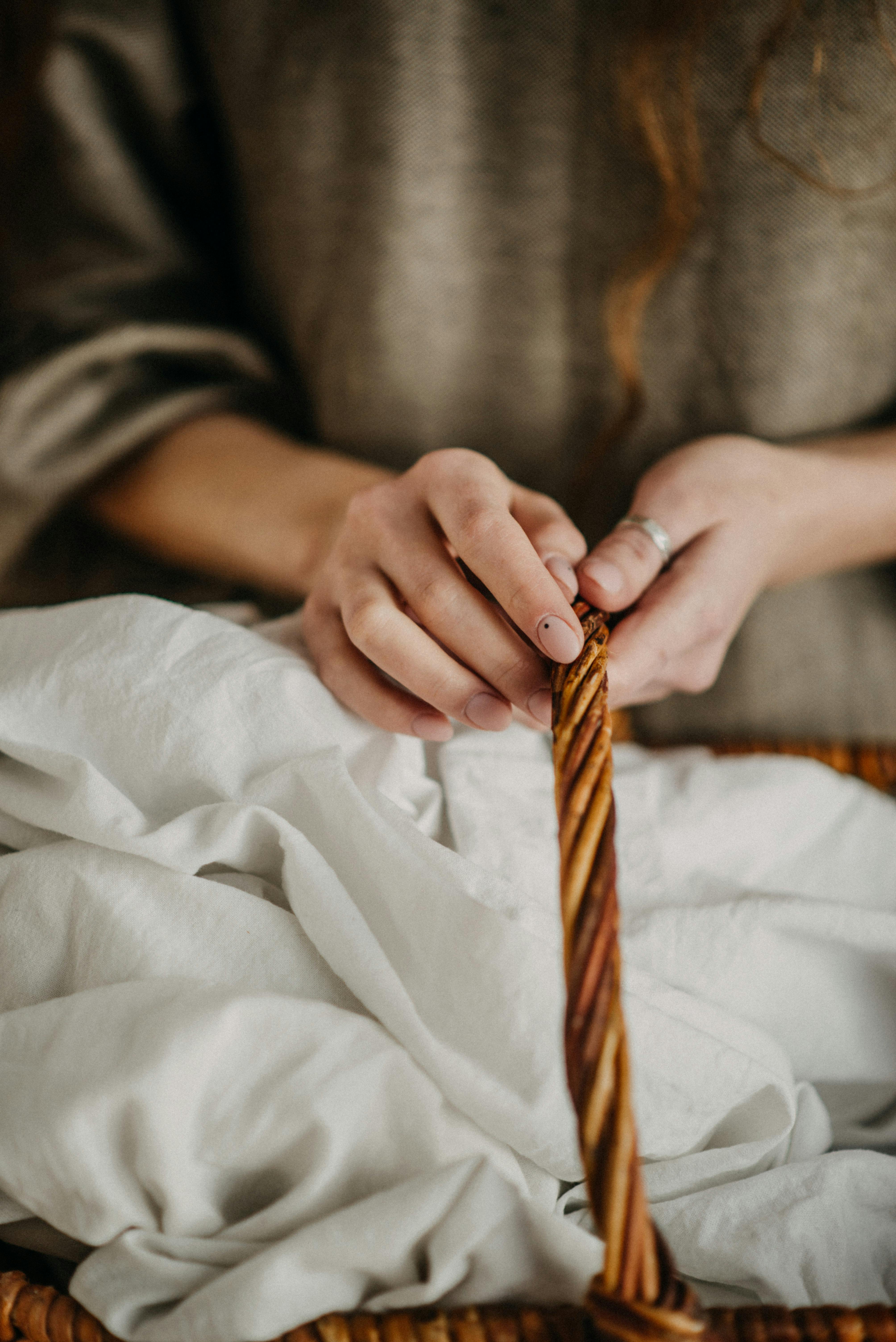 Crop woman touching cloth with inscription · Free Stock Photo