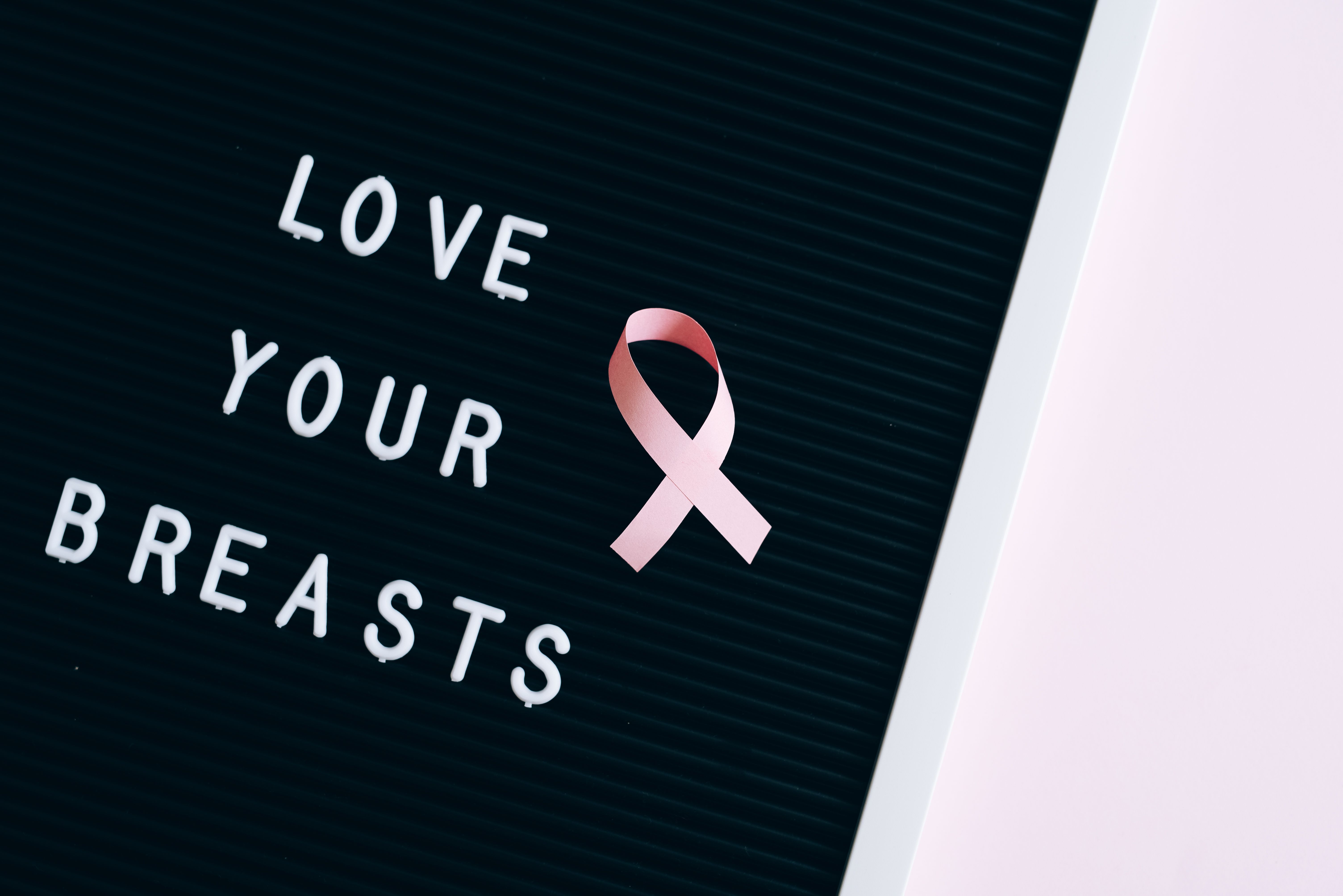 A Brassiere Cutout on a Pink Surface · Free Stock Photo