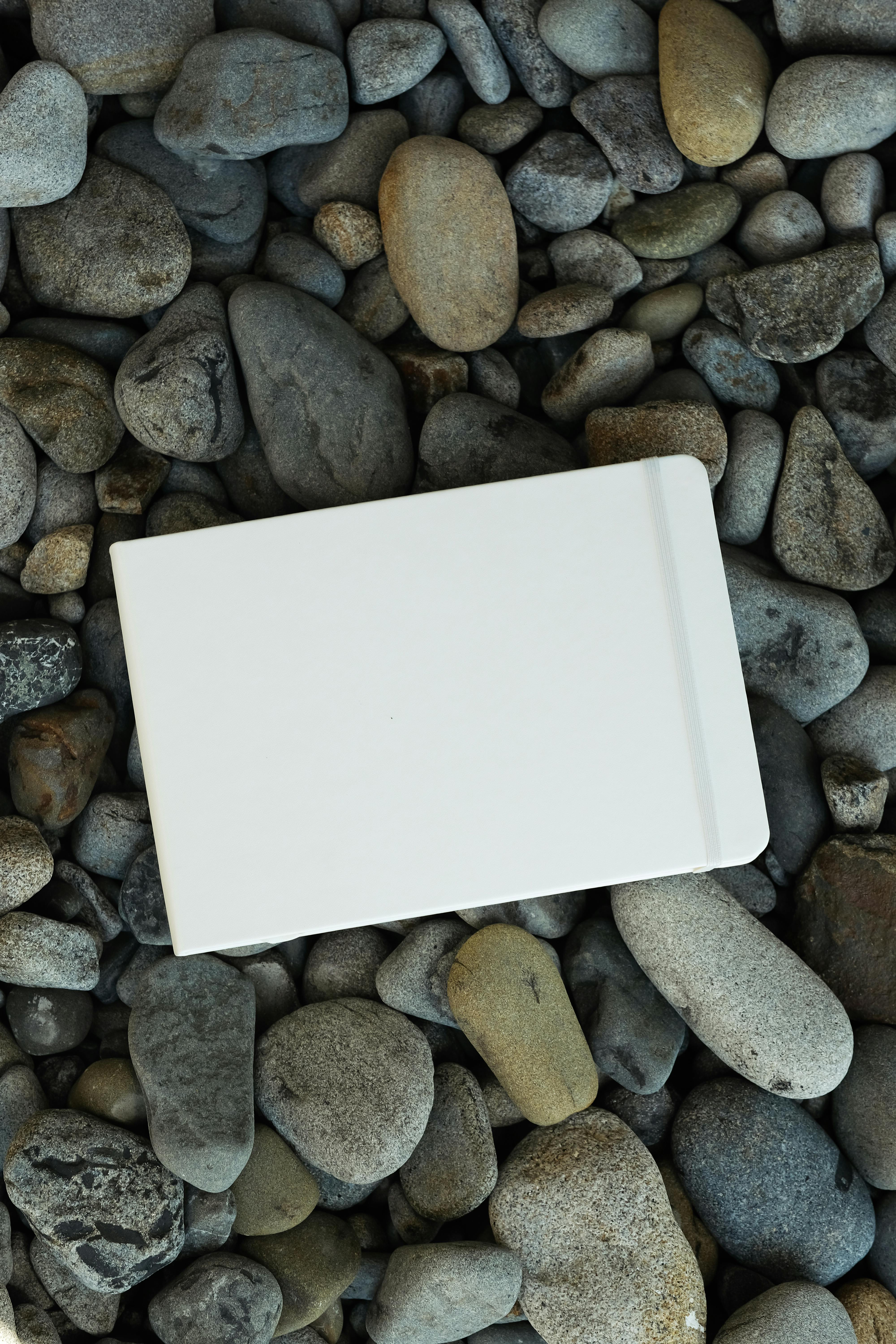 White Rectangular Notepad on the Ground · Free Stock Photo