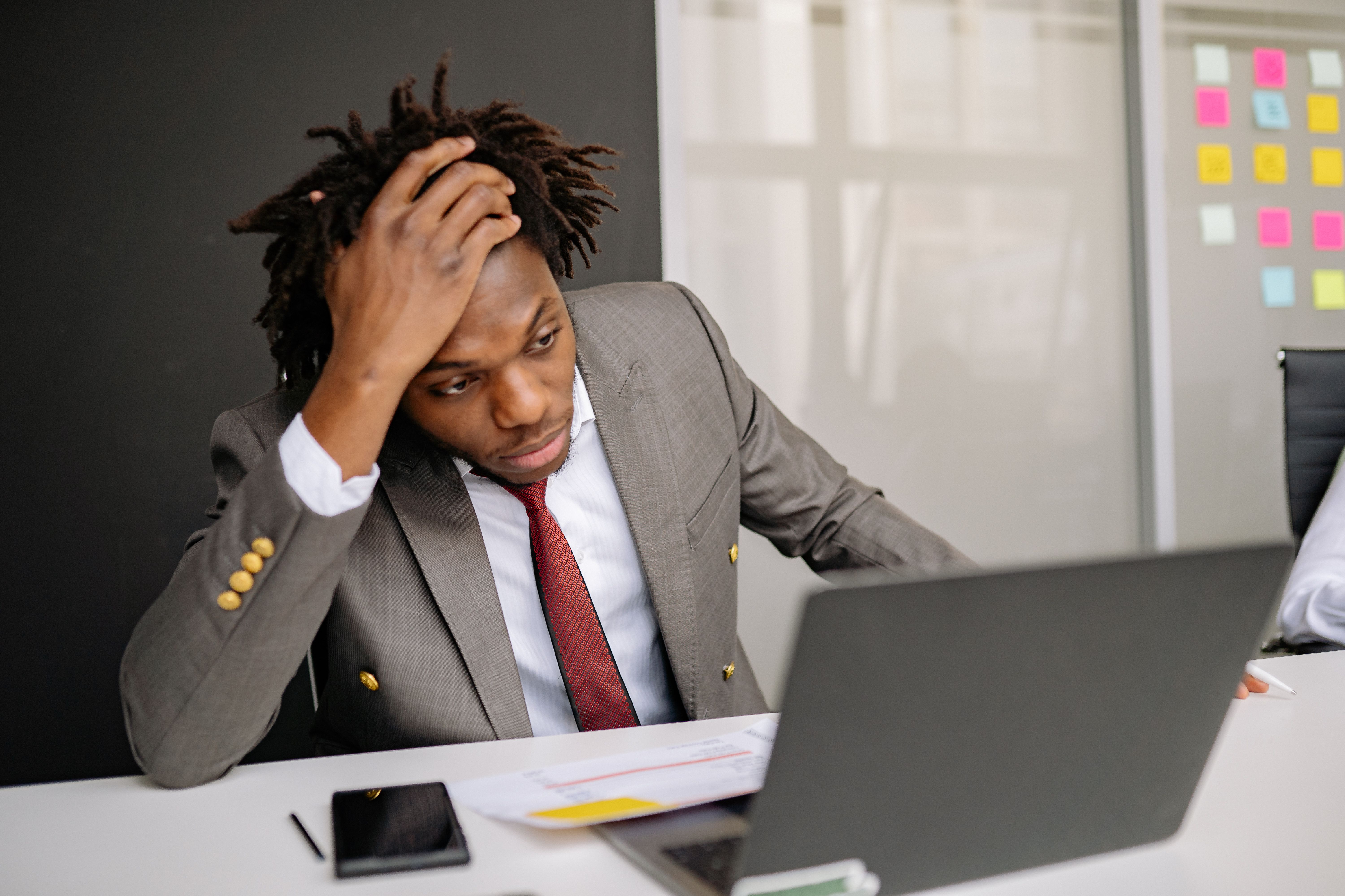 A Man Touching His Head · Free Stock Photo