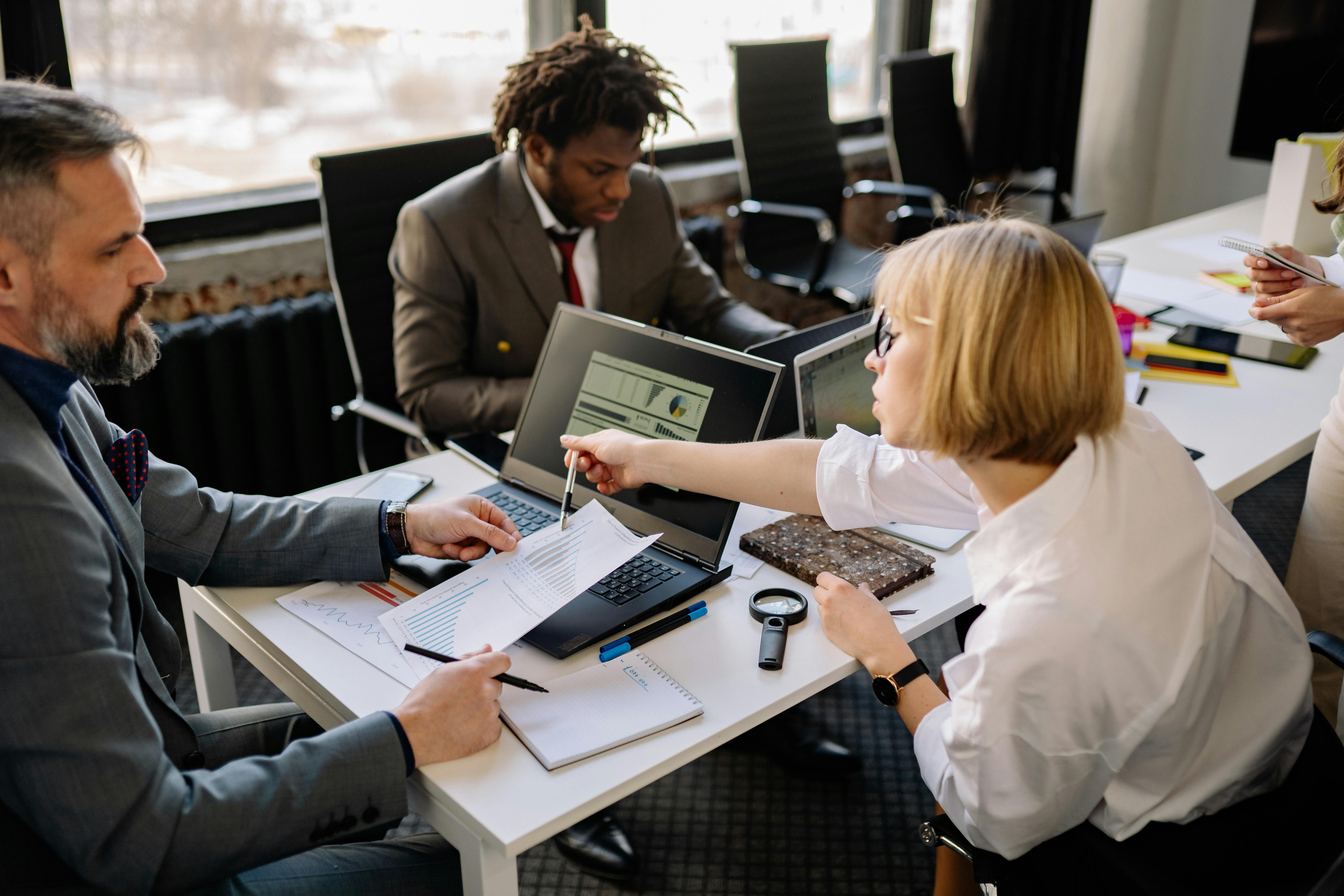 Woman Sharing Her Presentation with her Colleagues · Free Stock Photo
