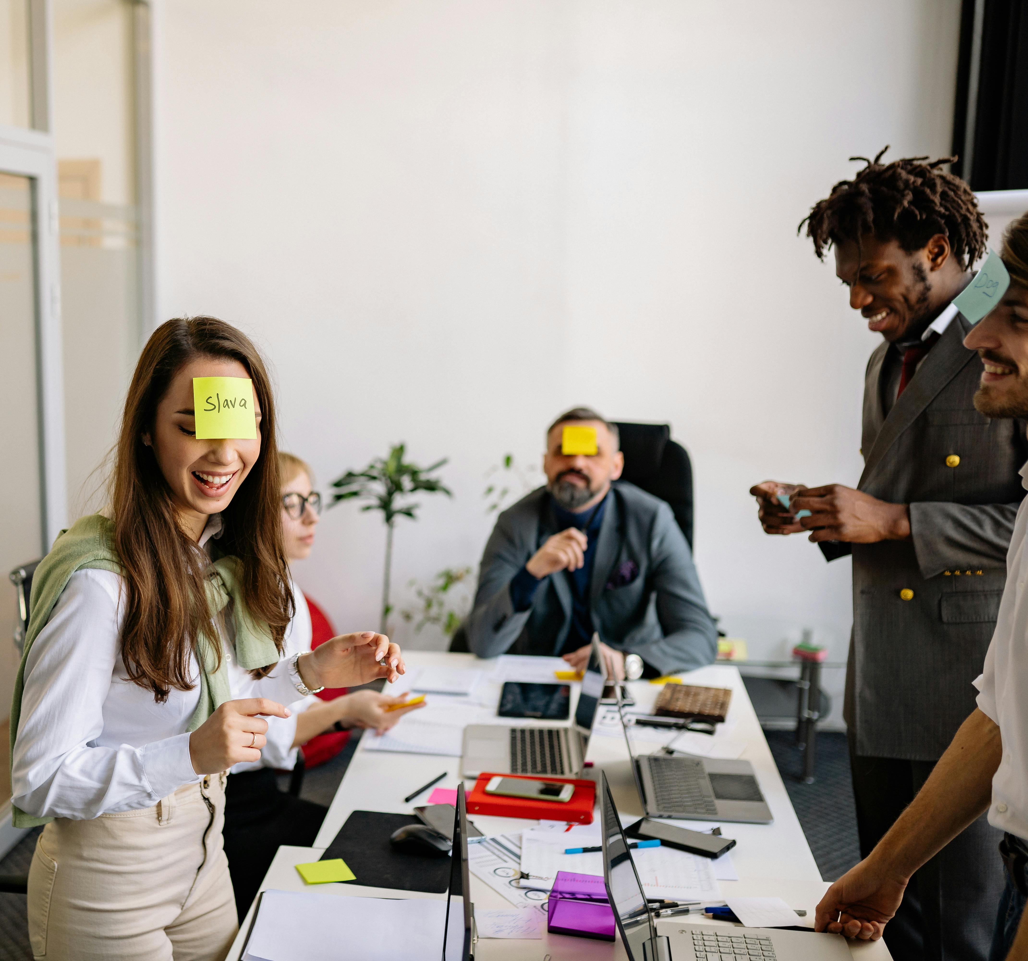 Woman in White Long Sleeve Shirt with Yellow Post It on her Forehead ...