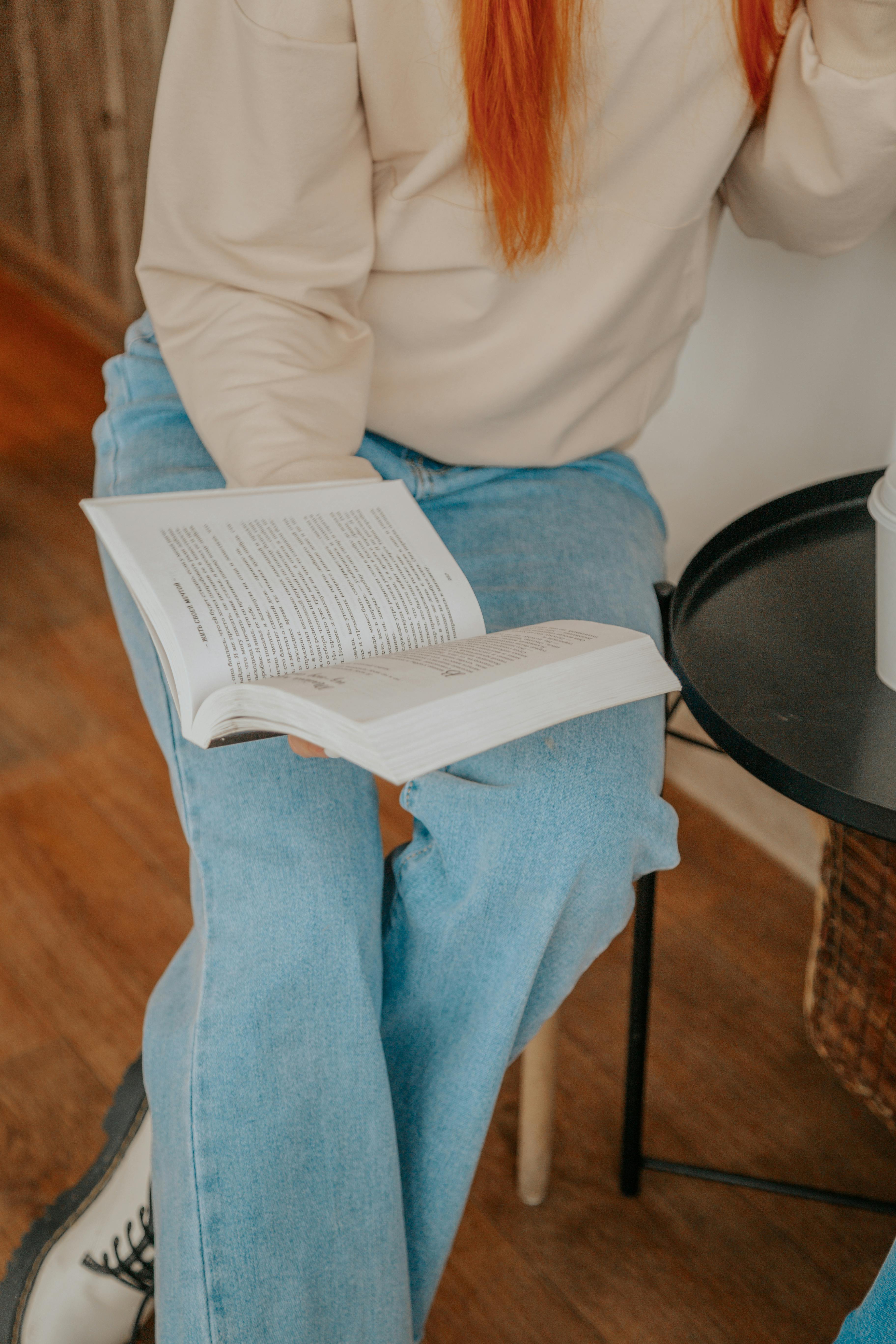 Person Standing Holding Magazine · Free Stock Photo