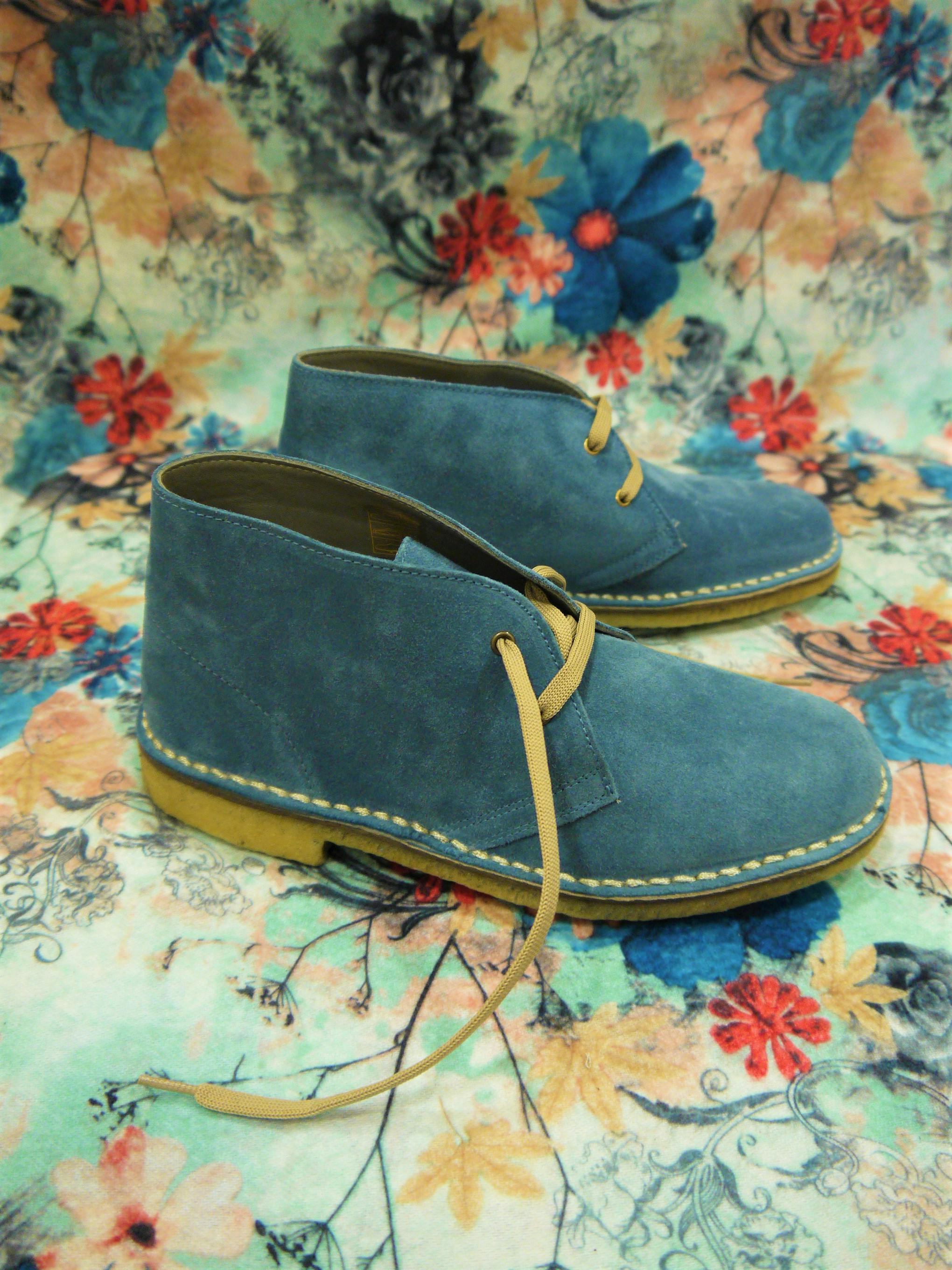 Blue Leather Shoes on a Floral Textile · Free Stock Photo