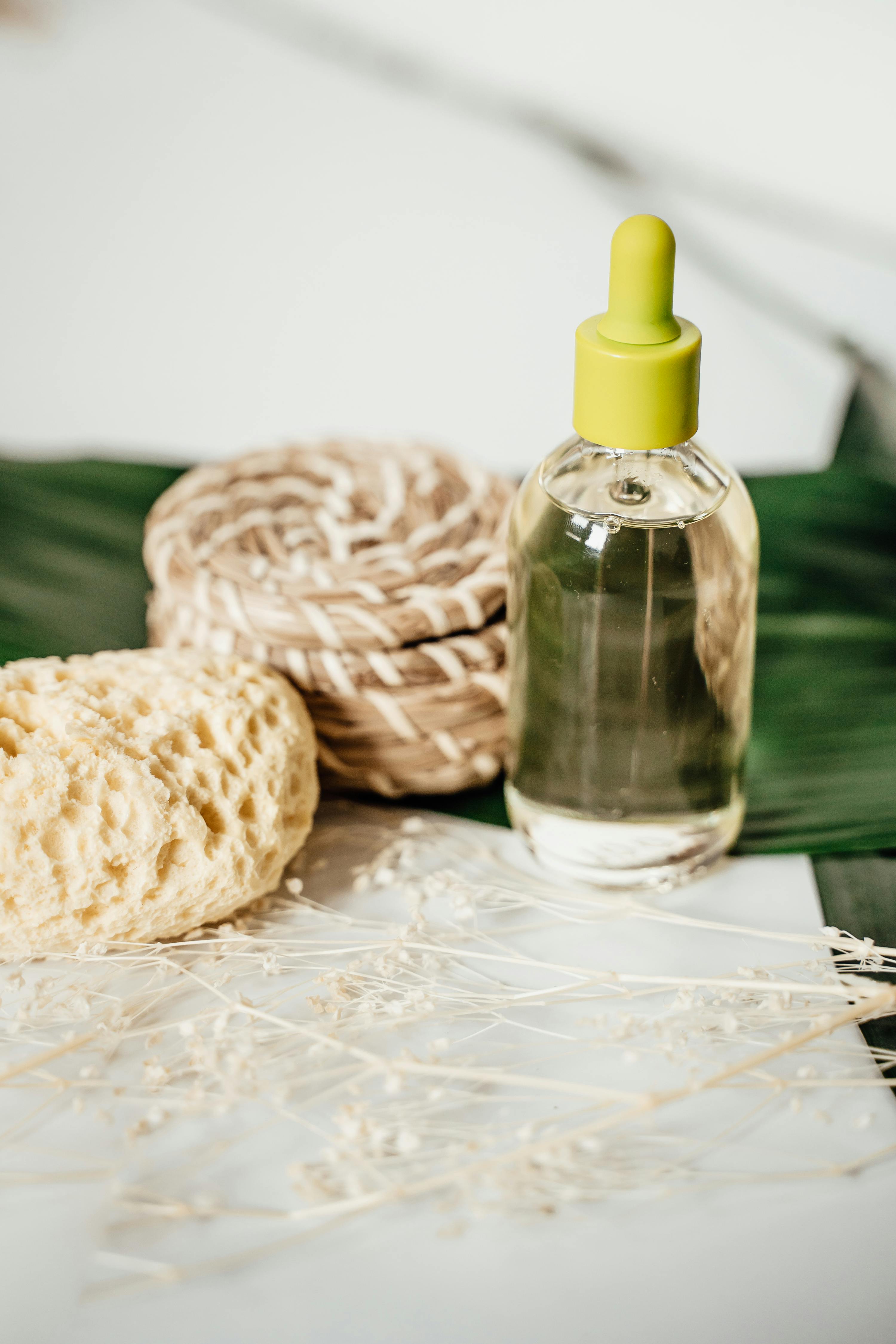 Droplets Dripping from Clear Dropper · Free Stock Photo